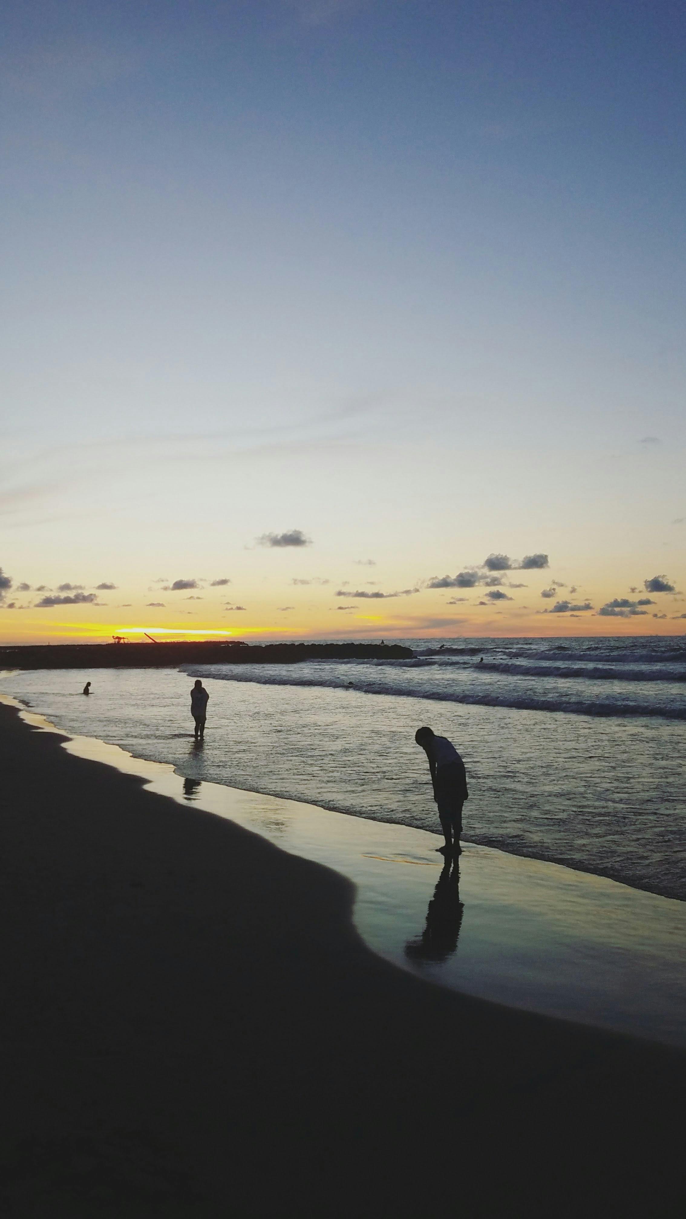 Two People at Beach during Sunrise · Free Stock Photo