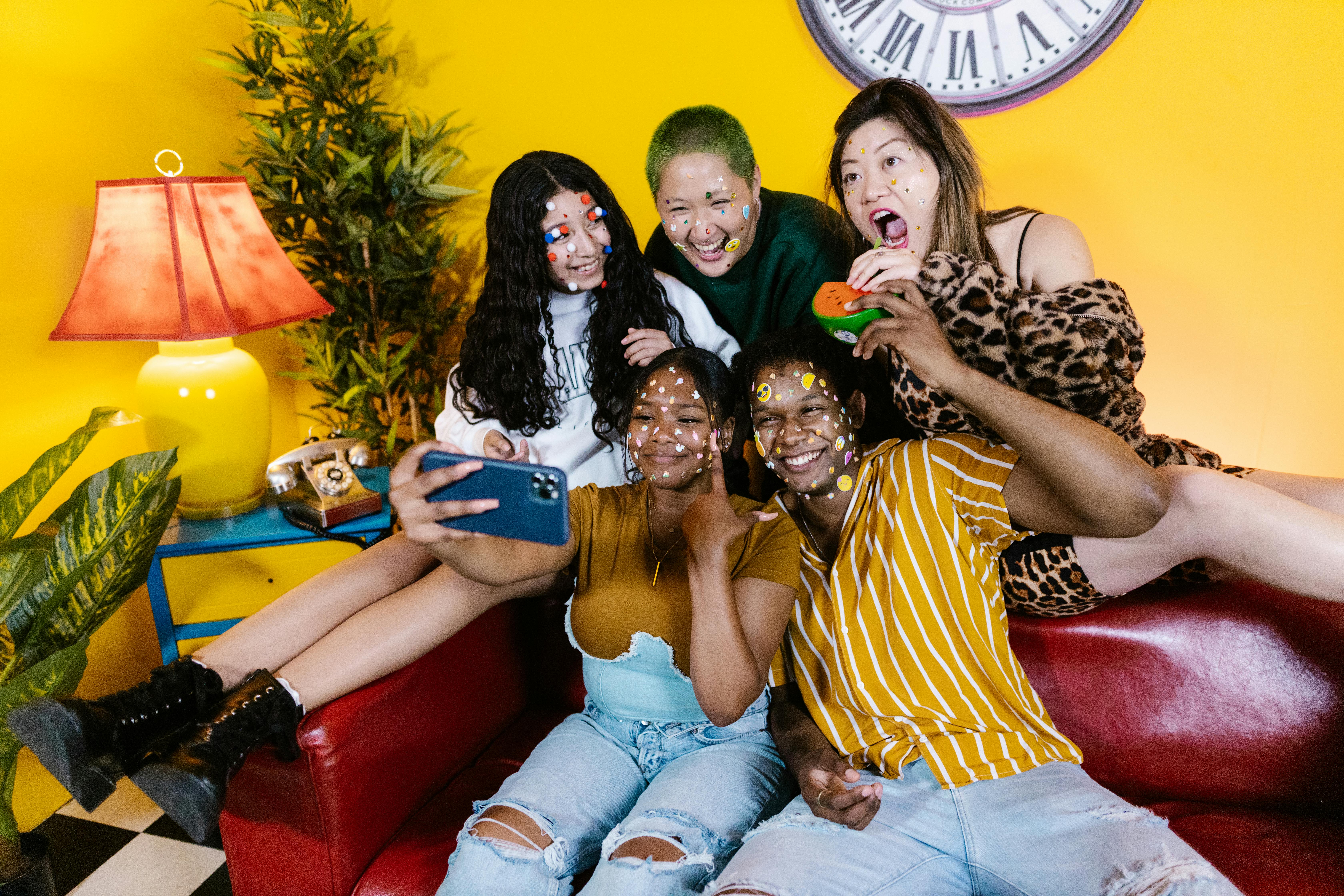 People with Face Stickers Taking a Selfie · Free Stock Photo