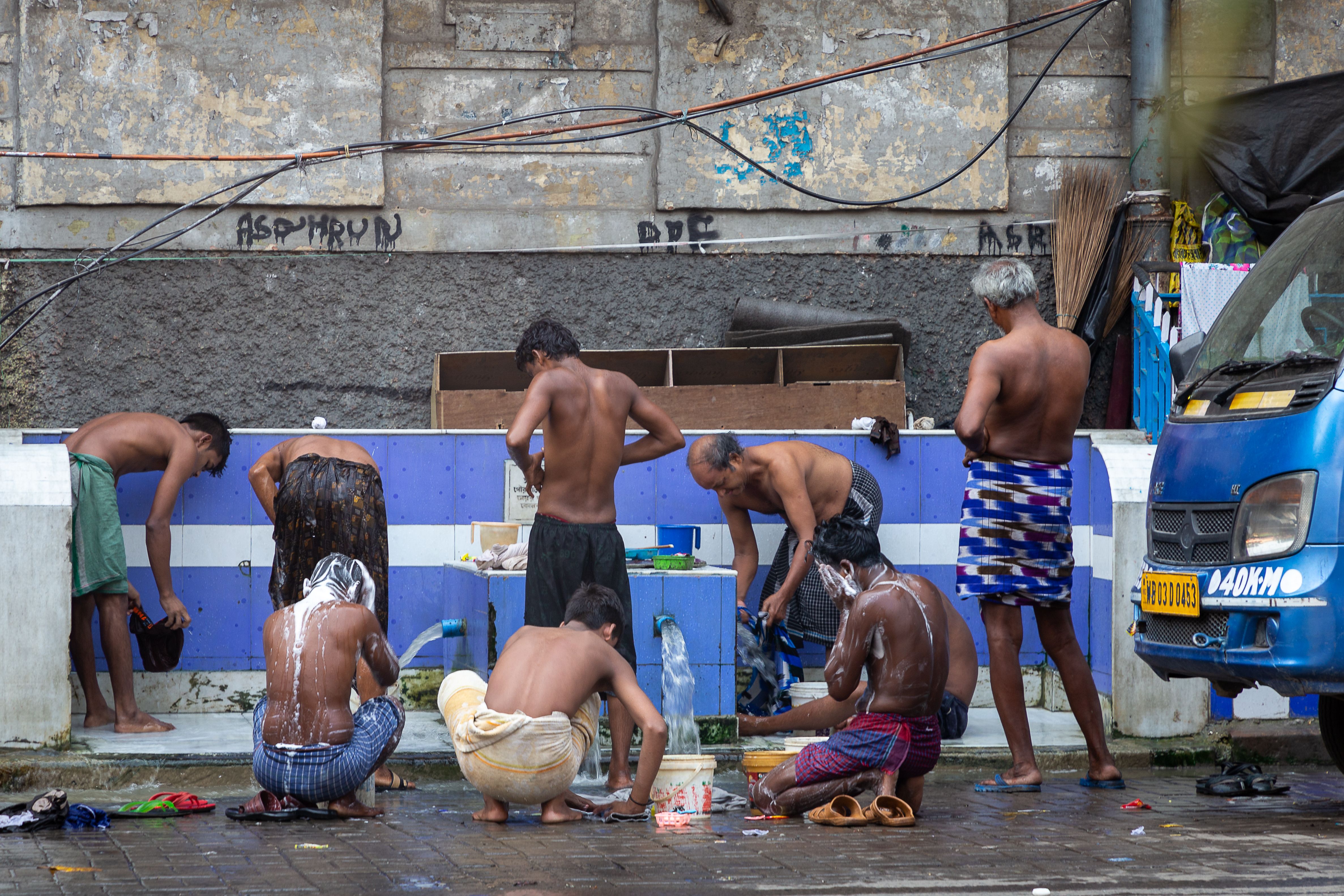 Men Taking a Bath Outside · Free Stock Photo