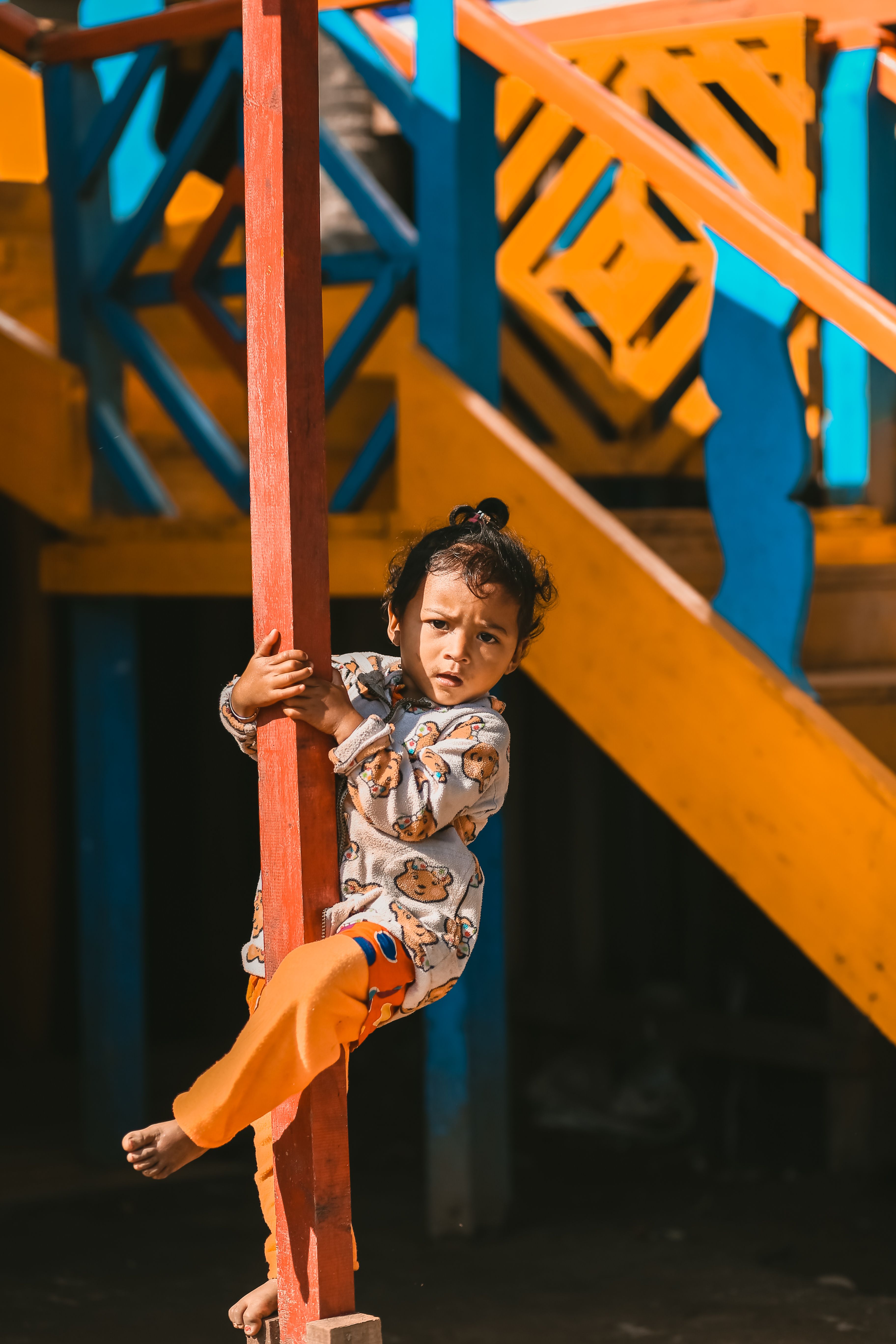 Girl Climbing a Wooden Pole · Free Stock Photo
