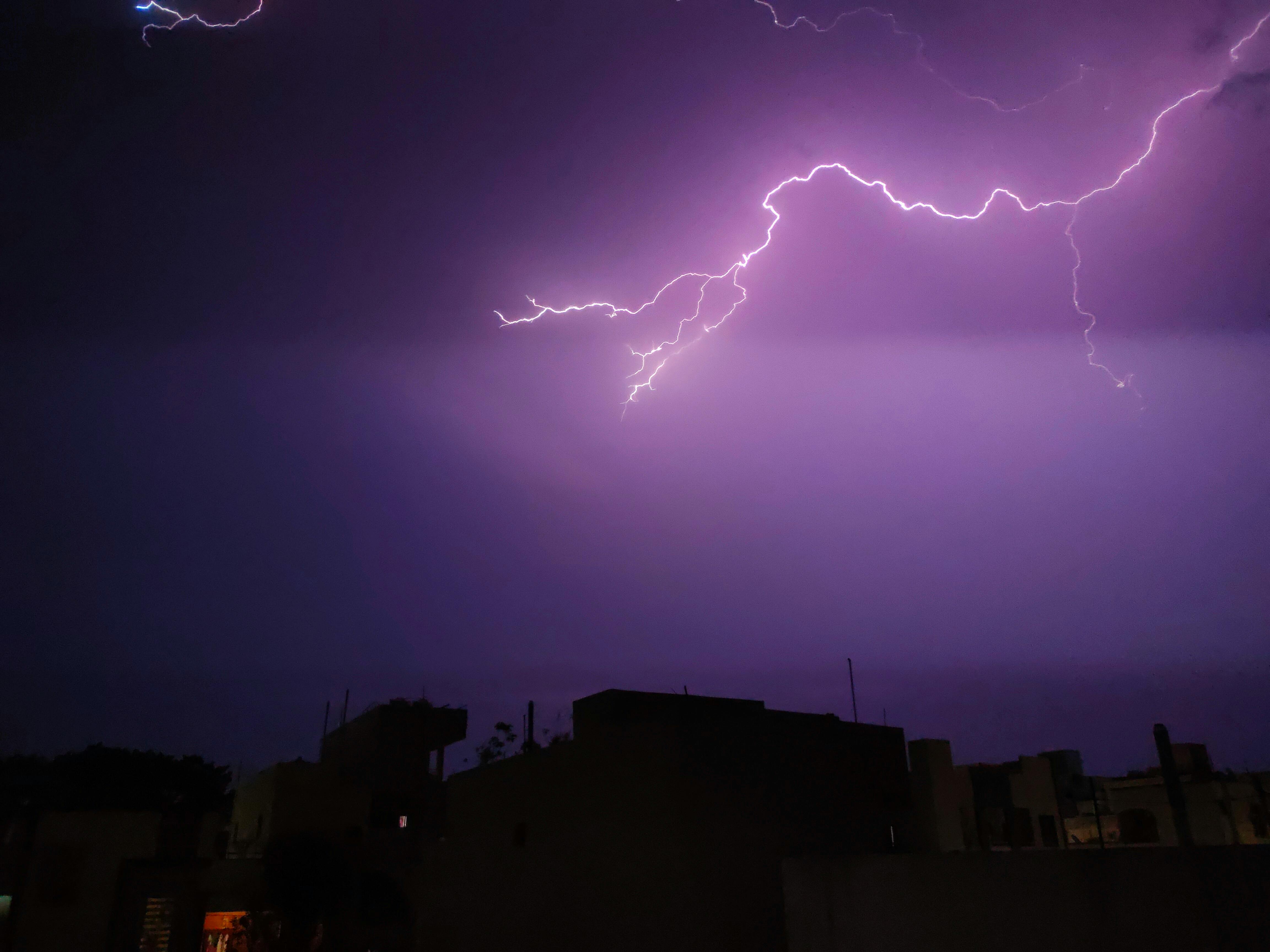 Woman Sitting On A Lightning Suitcase · Free Stock Photo