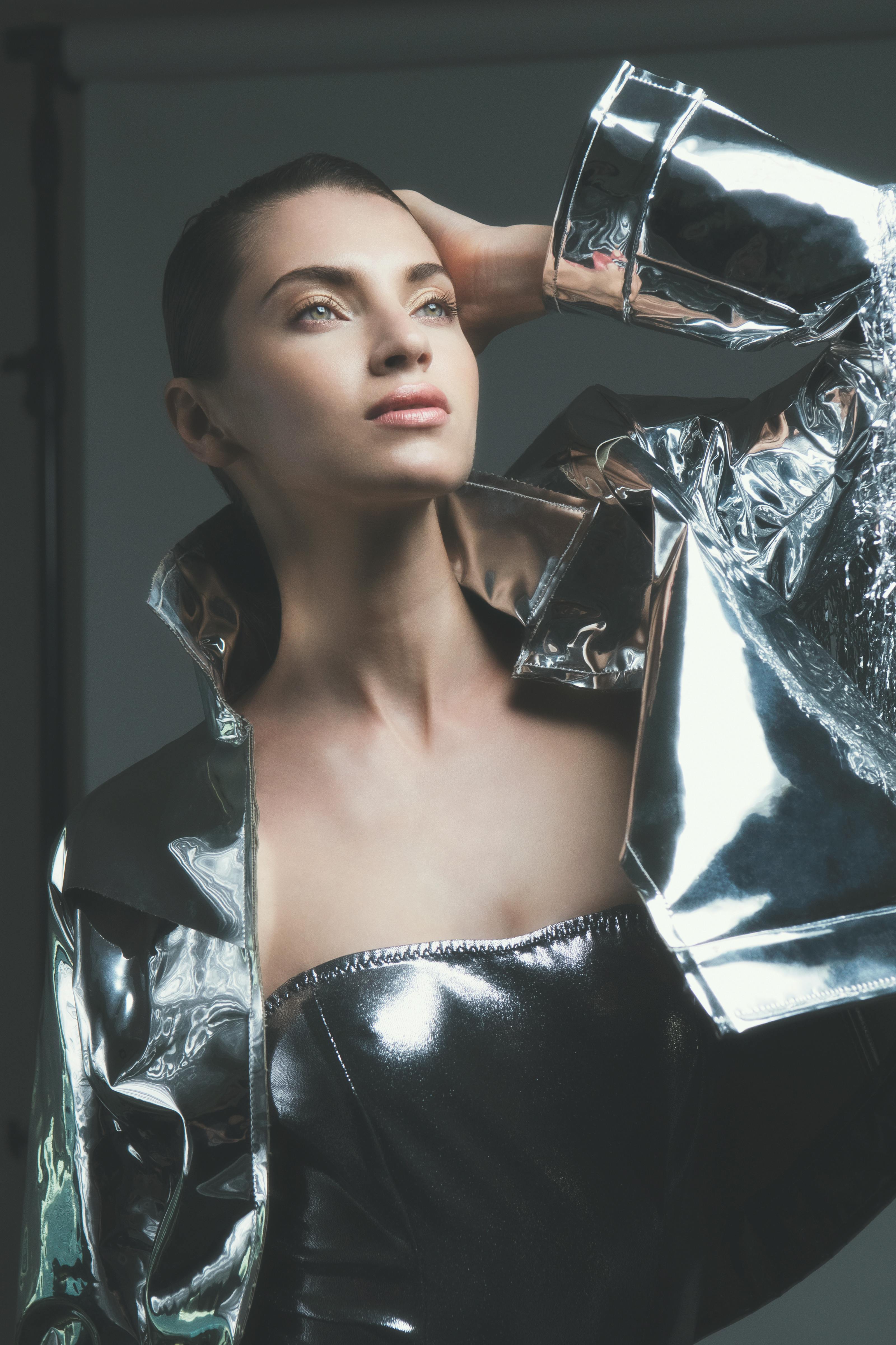 A Woman Wearing a Silver Outfit · Free Stock Photo
