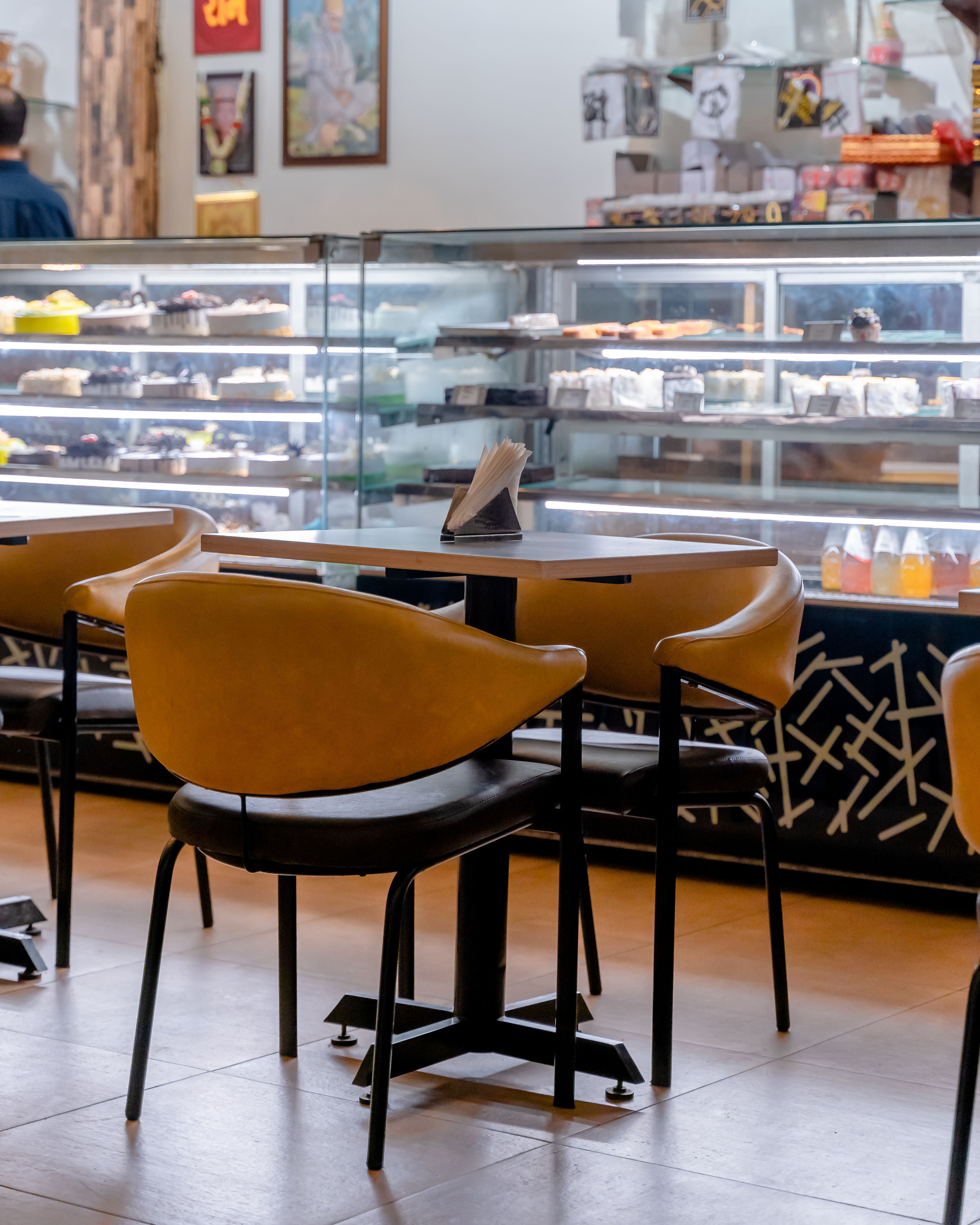Cafe Interior with Leather Seats and Wooden Tables · Free Stock Photo