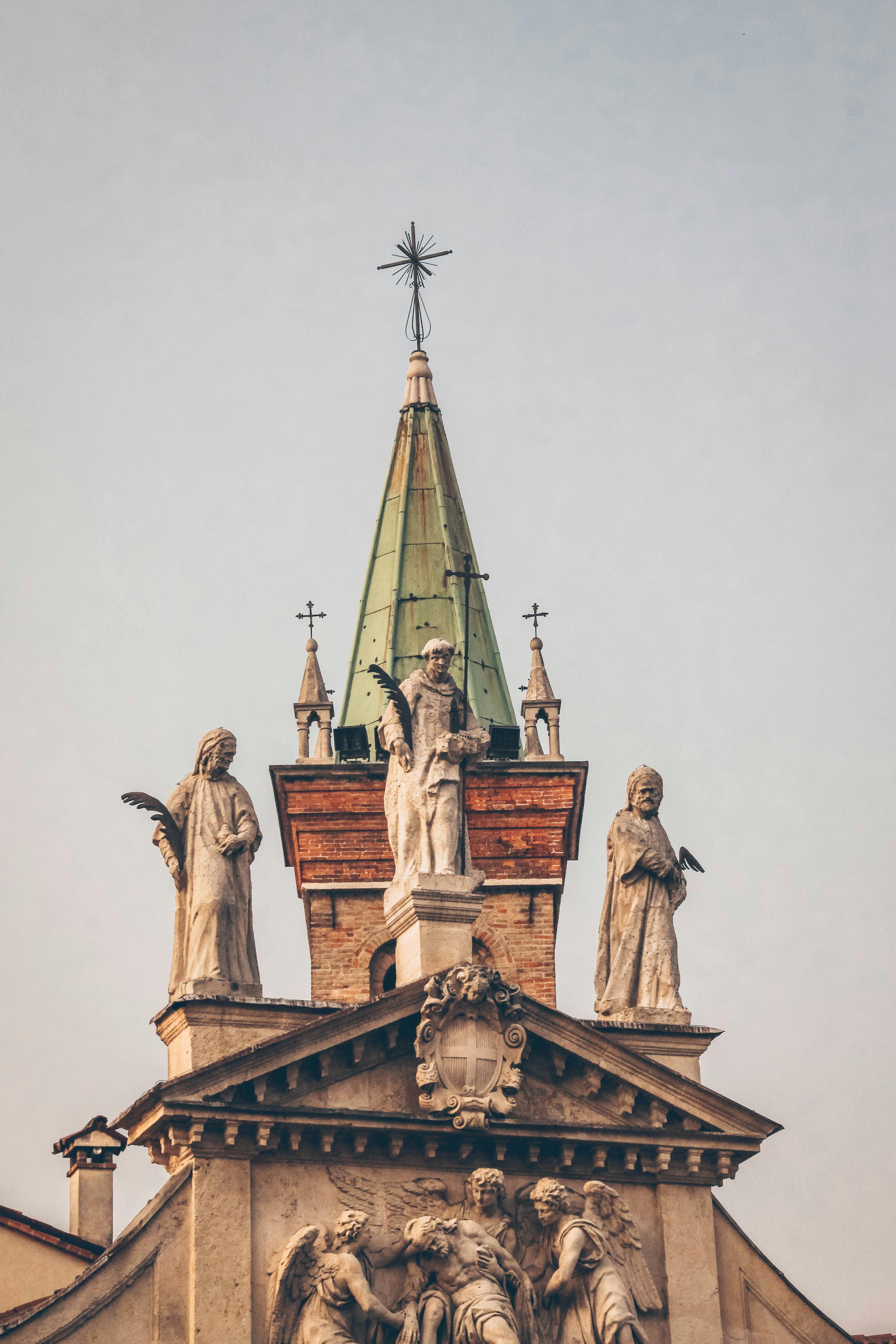 Photo of Statues on Tower · Free Stock Photo