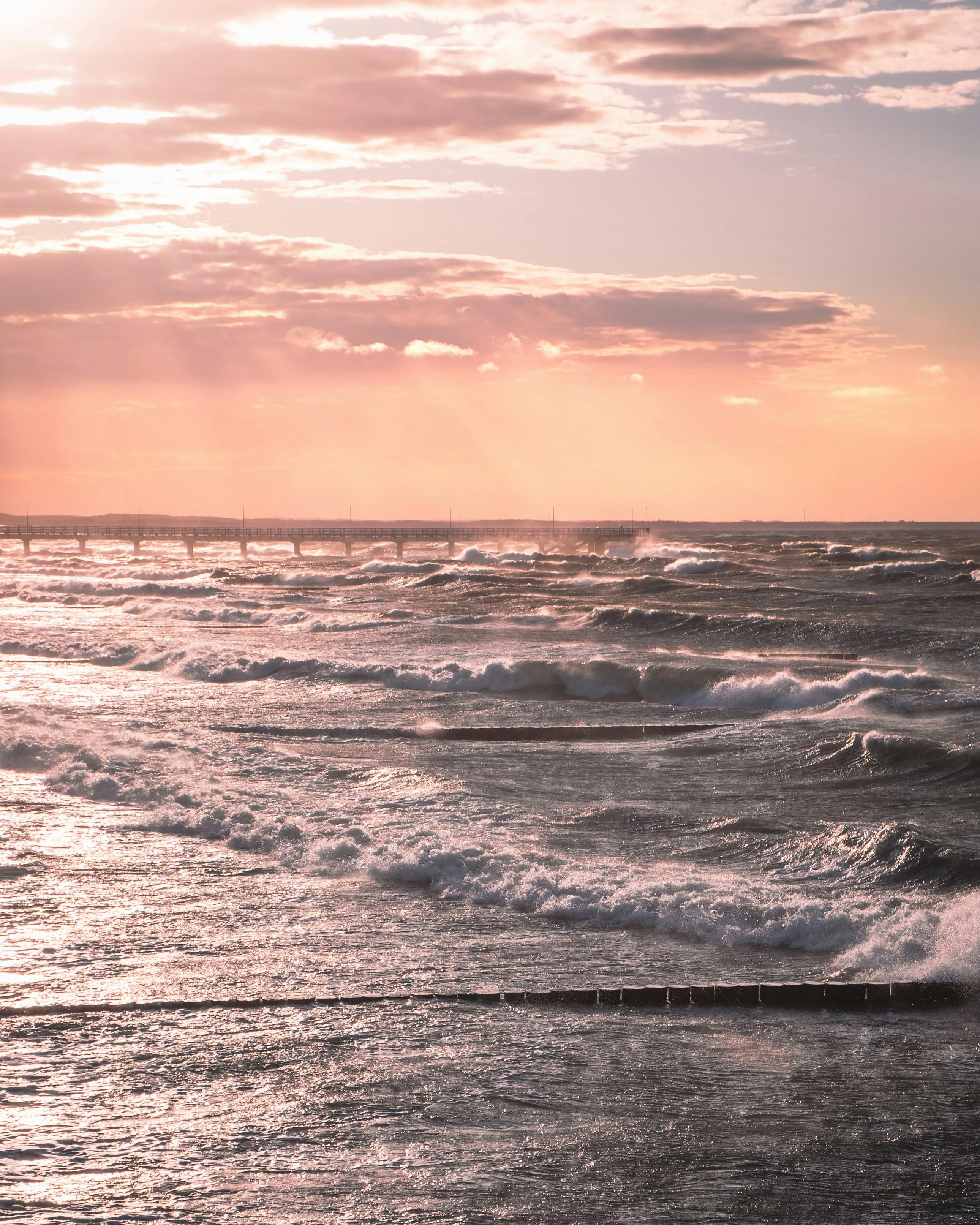 Blue Ocean Water Under the White Sky · Free Stock Photo