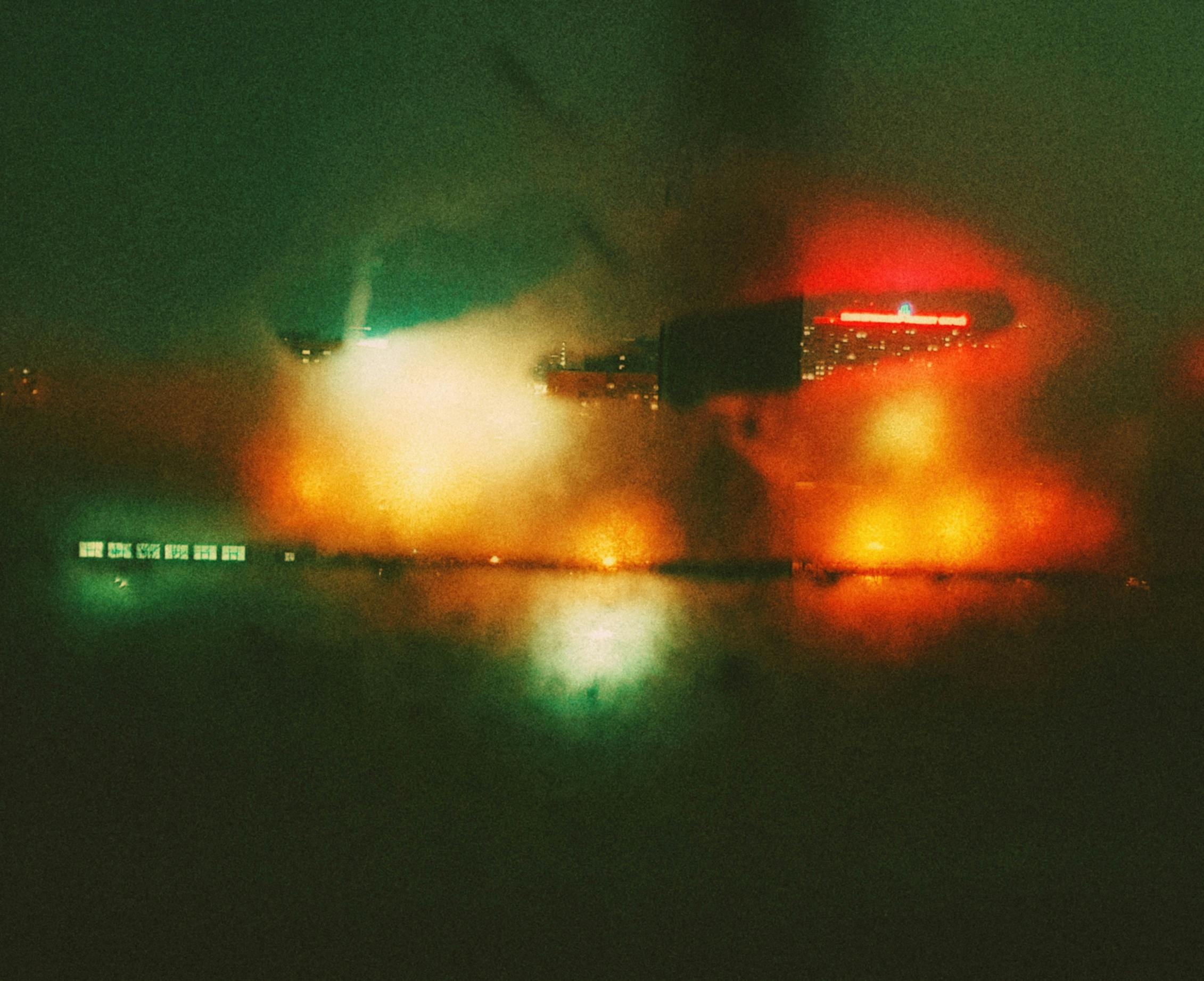 City Skyline at Night Seen Through Fogged up Window · Free Stock Photo