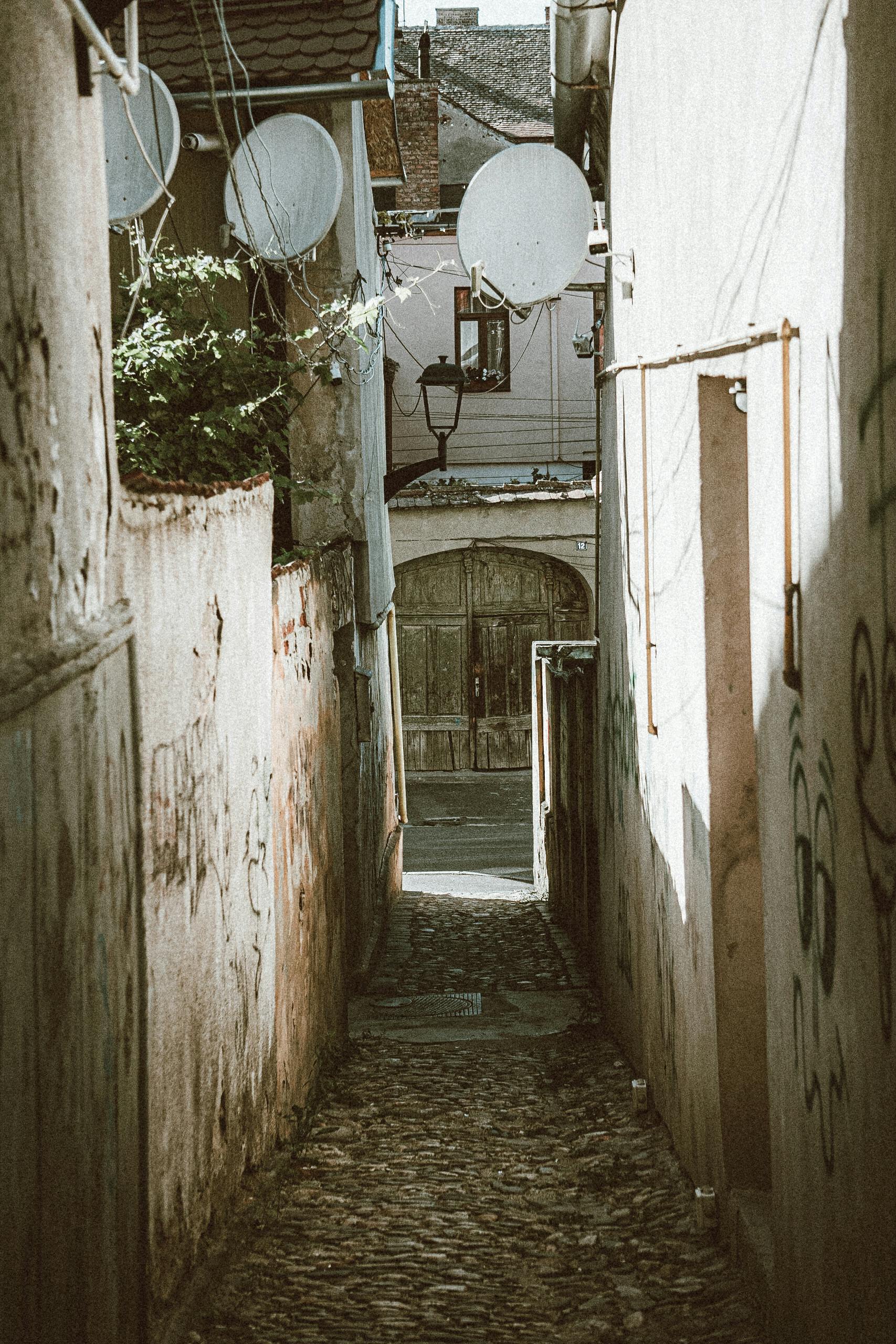 Narrow Alley Between Apartment Buildings · Free Stock Photo