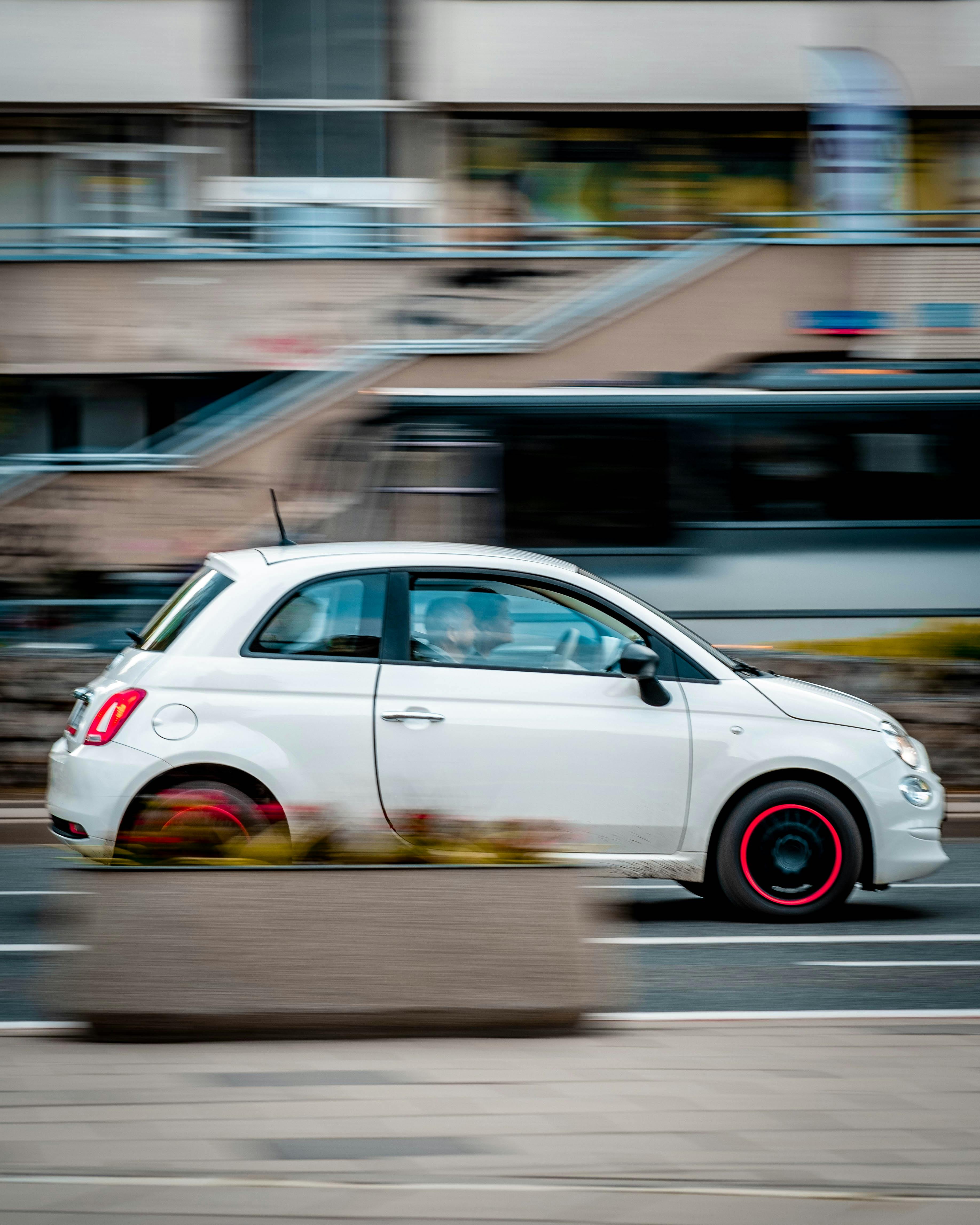 A White Car Moving on the Road · Free Stock Photo