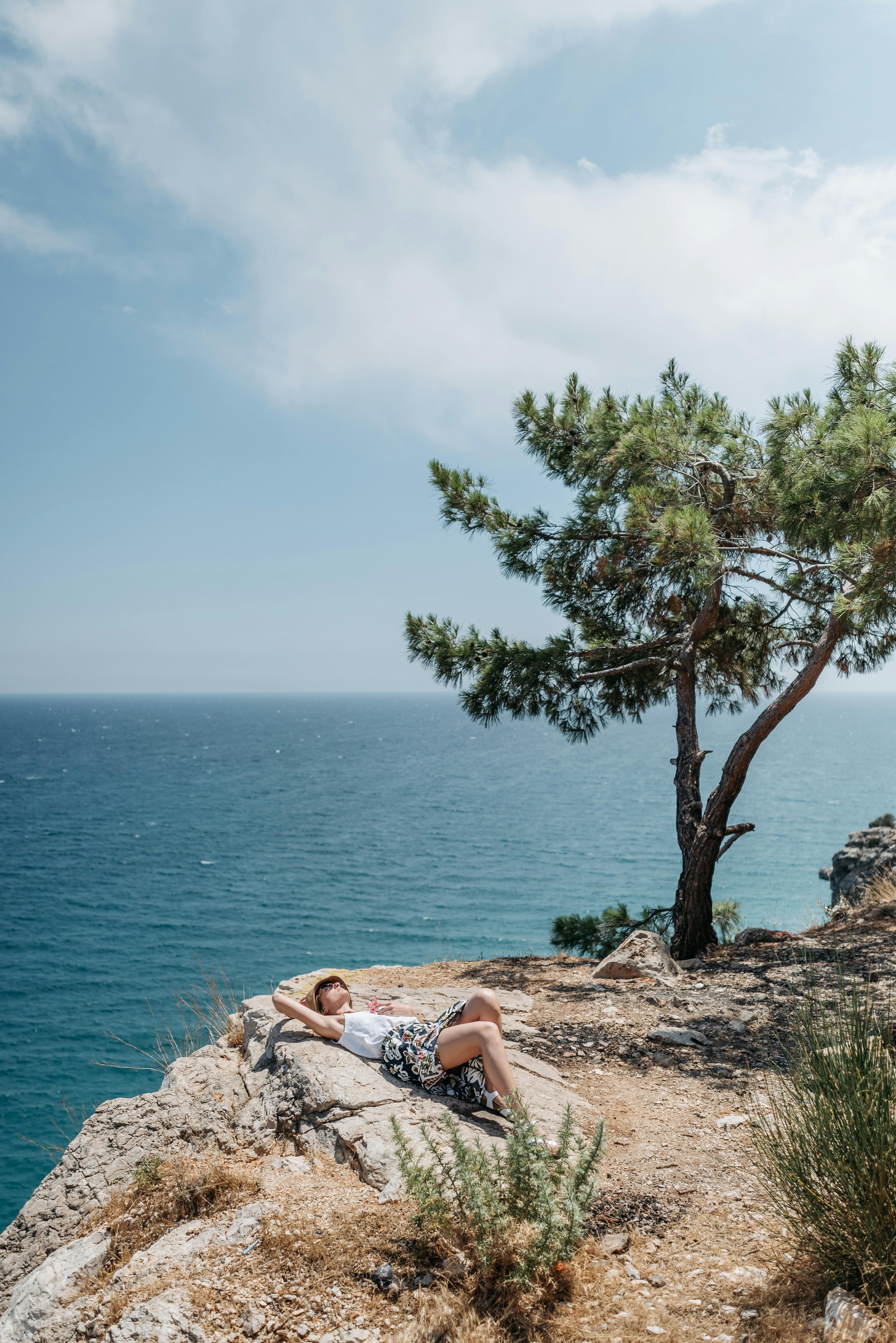 A Woman Lying on the Rock · Free Stock Photo
