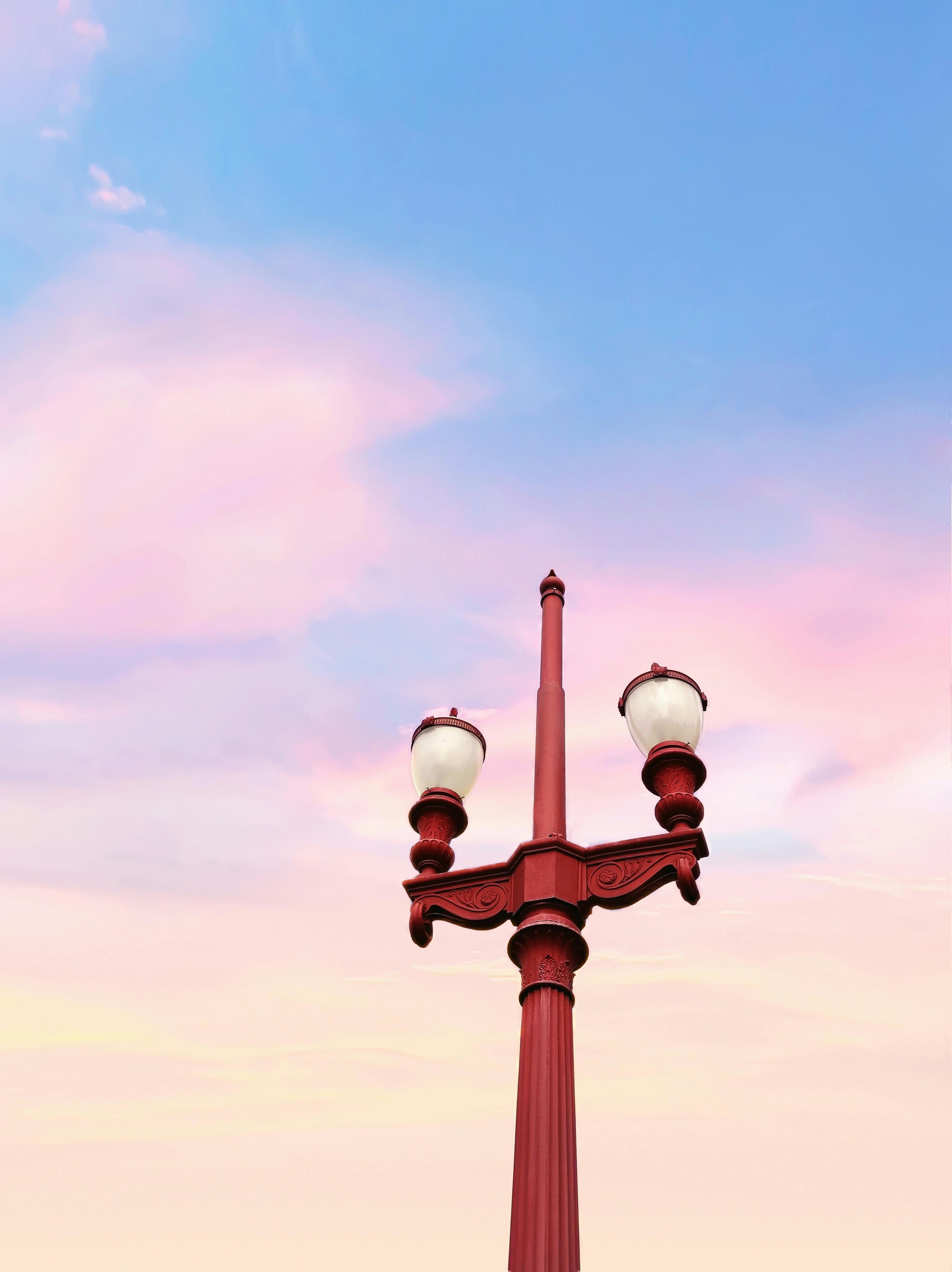A Red Street Light Under Blue Sky · Free Stock Photo