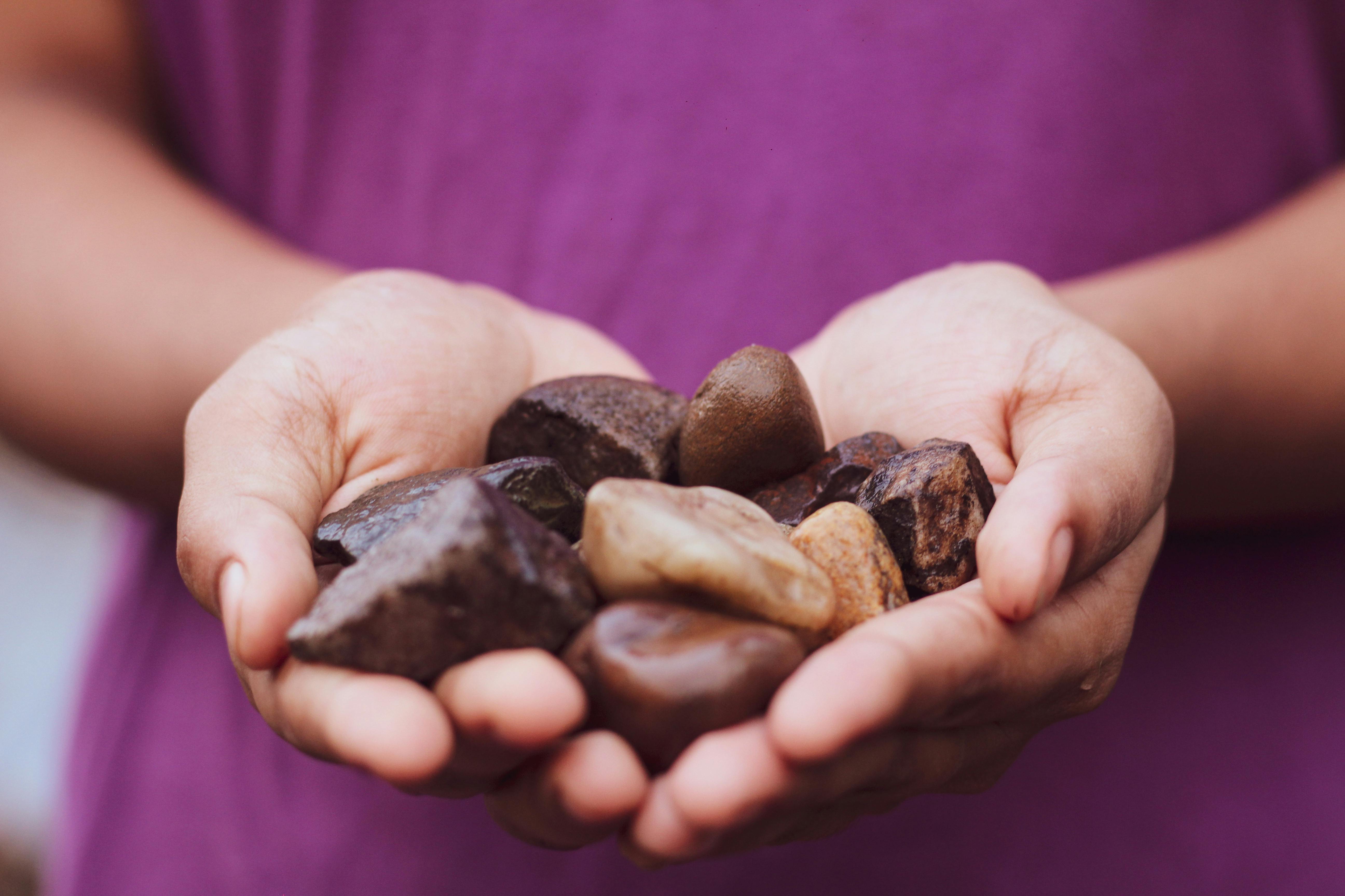 Person carrying Small Rocks · Free Stock Photo