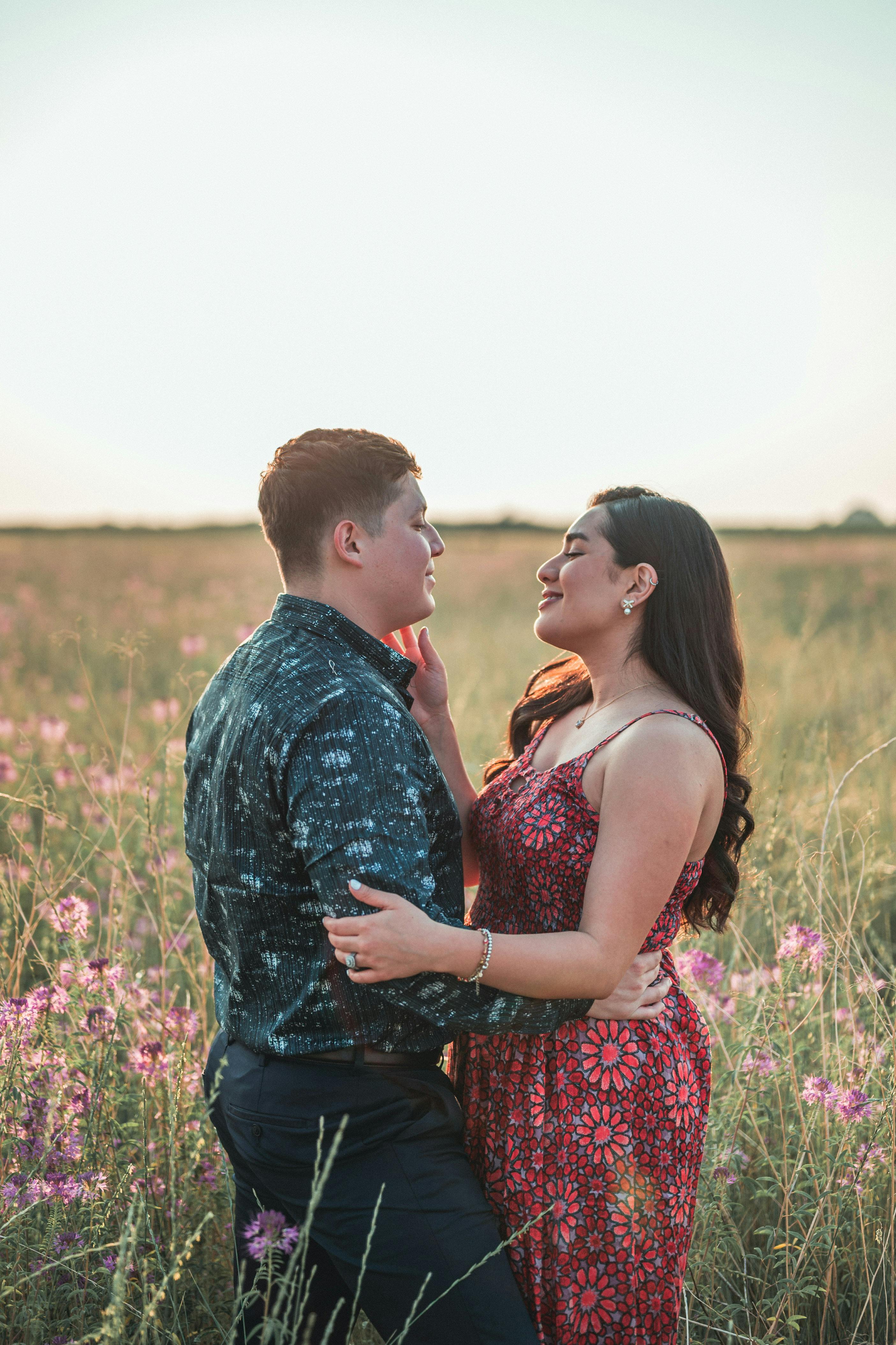 Couple of women with opposite appearance in sand area · Free Stock Photo