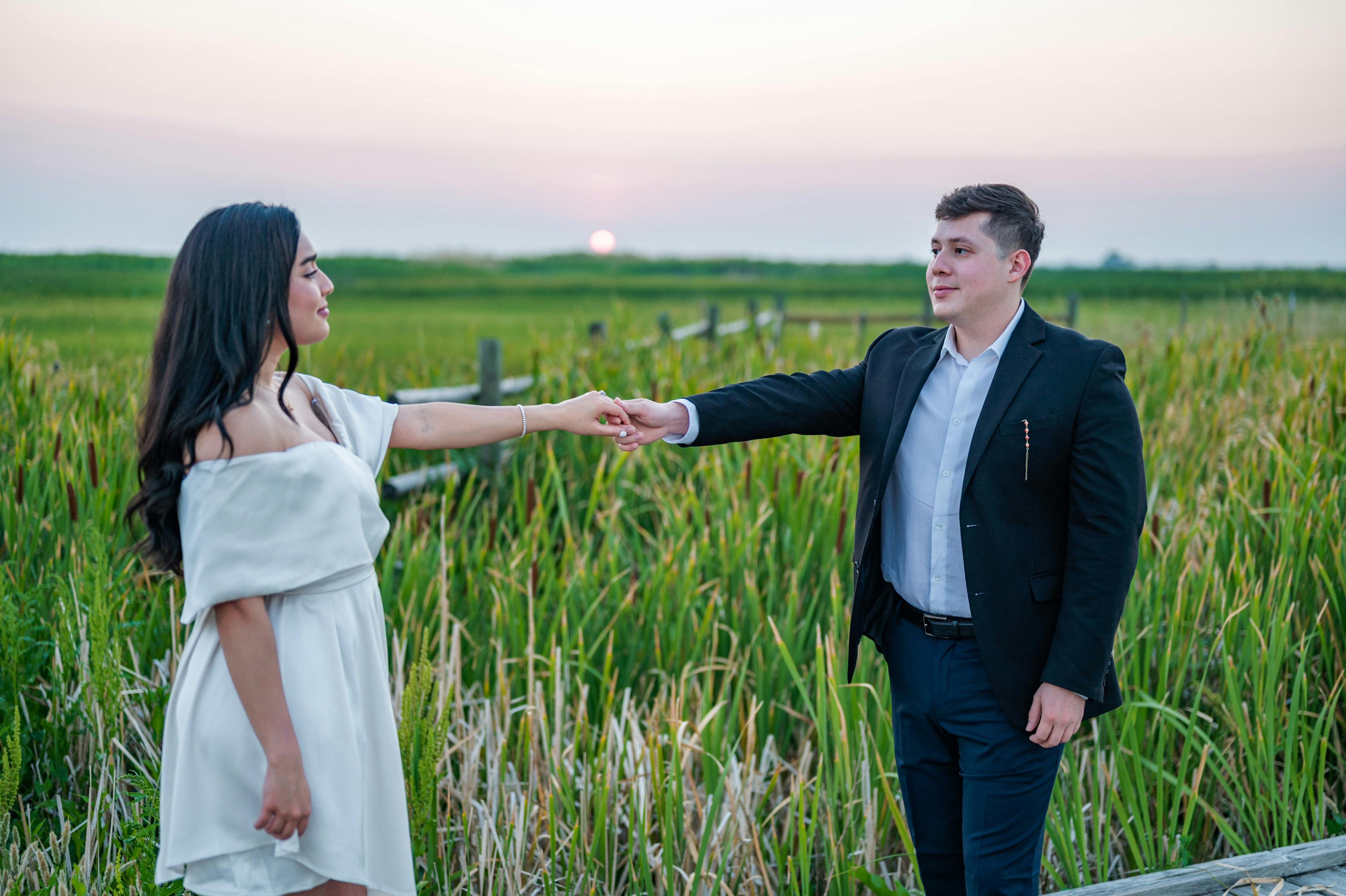 Couple in Traditional Garments standing near Pagoda · Free Stock Photo