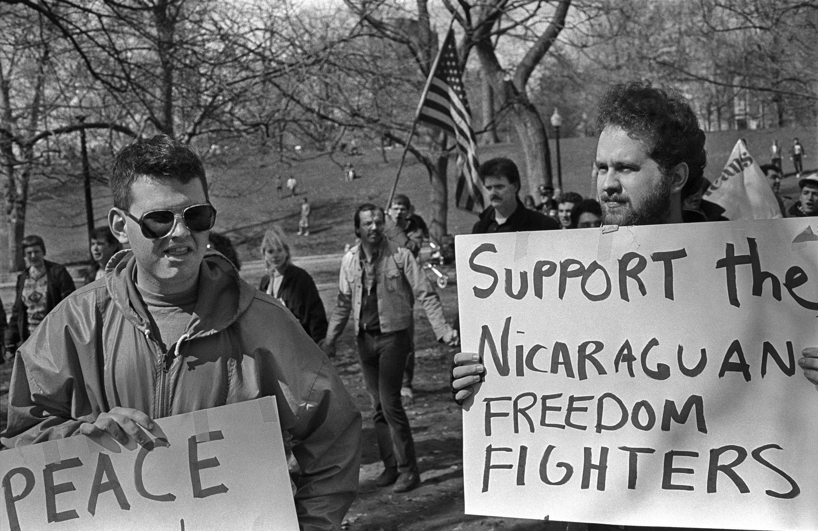 Grayscale Photo of People Holding Posters · Free Stock Photo