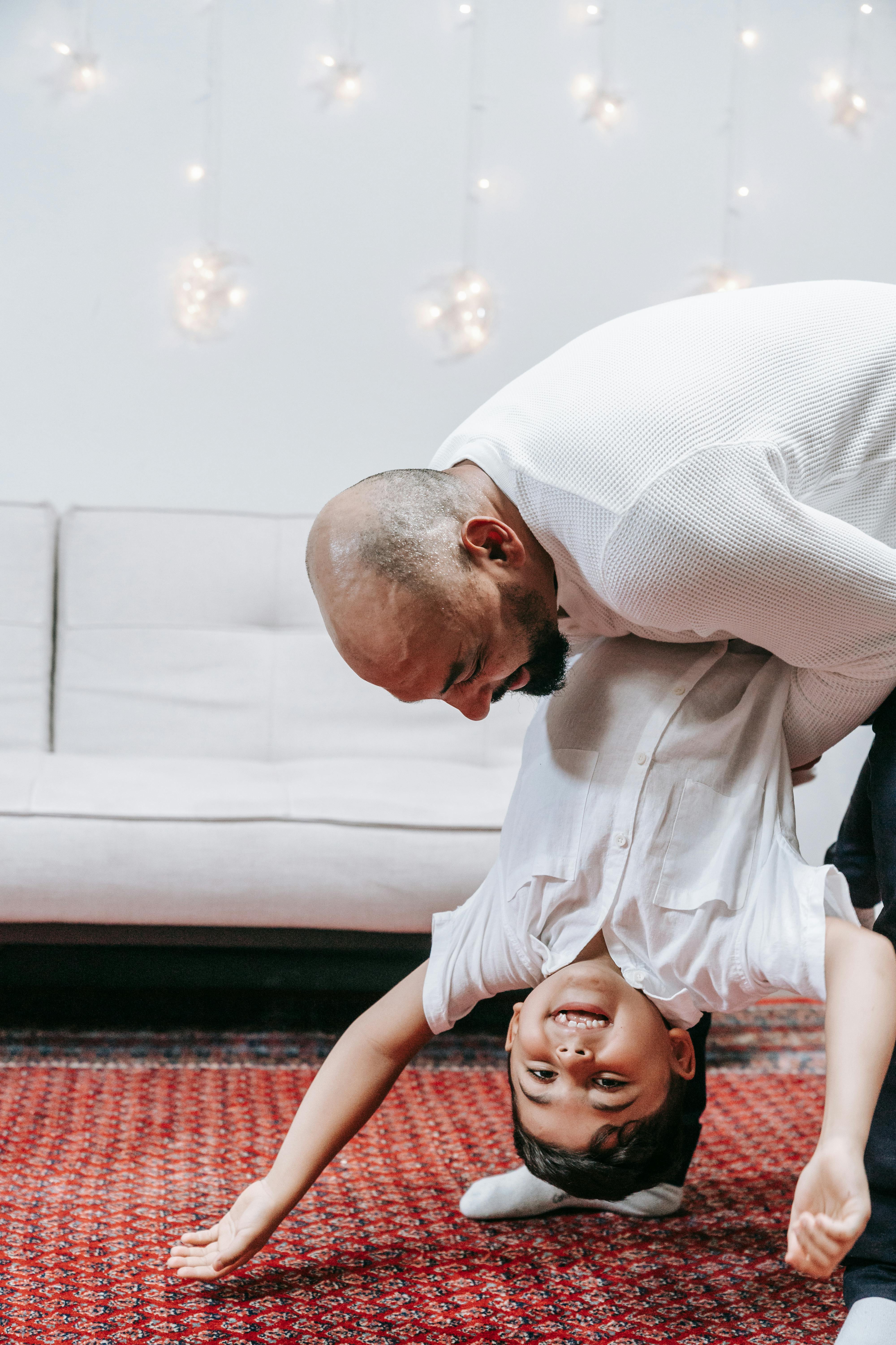 A Man Carrying His Child · Free Stock Photo