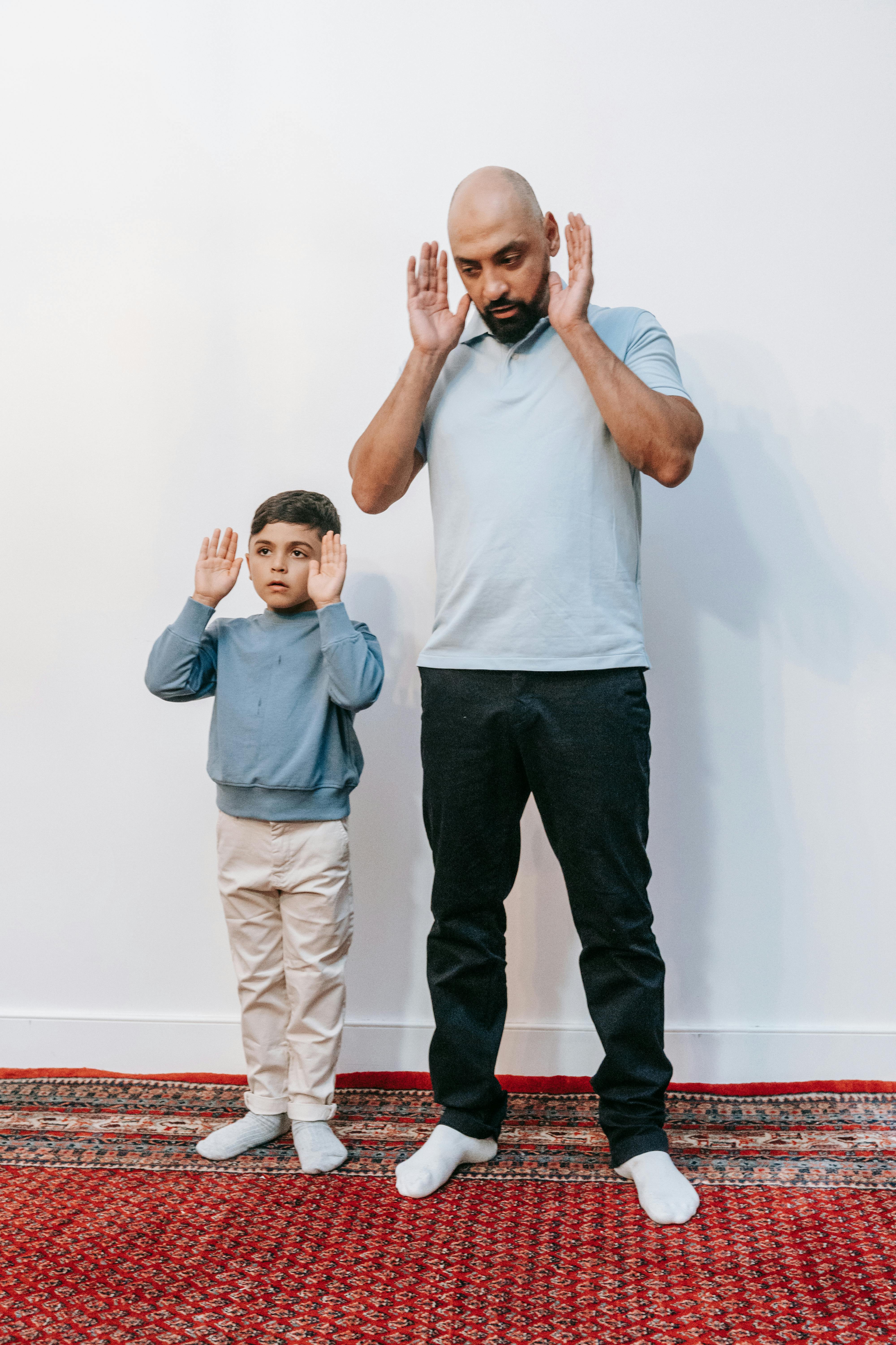 Father and Son Raising their Arms · Free Stock Photo