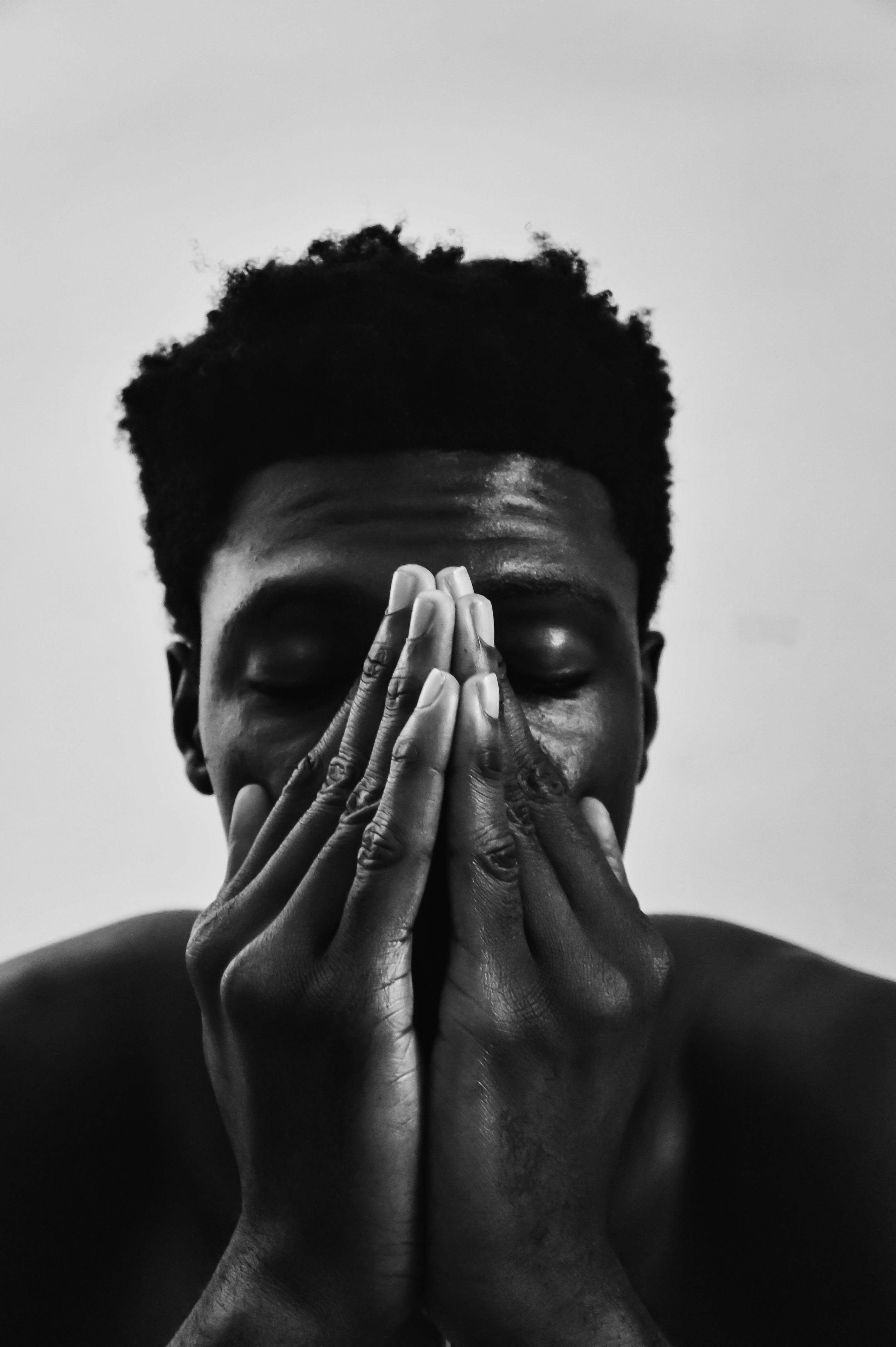 Gray Scale Photo of Topless Man Covering Face · Free Stock Photo