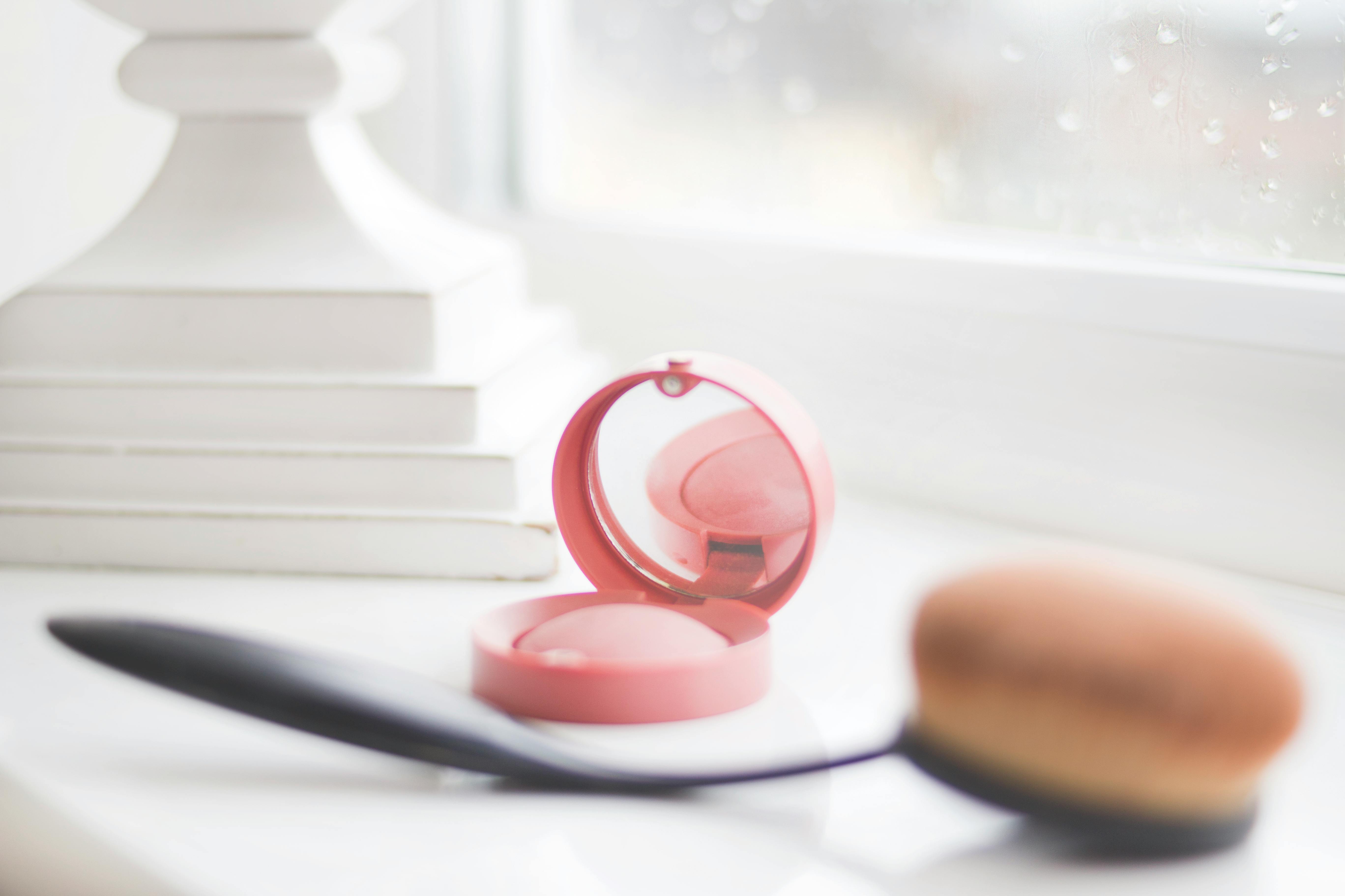 Pressed Powders on White and Beige Surfaces · Free Stock Photo