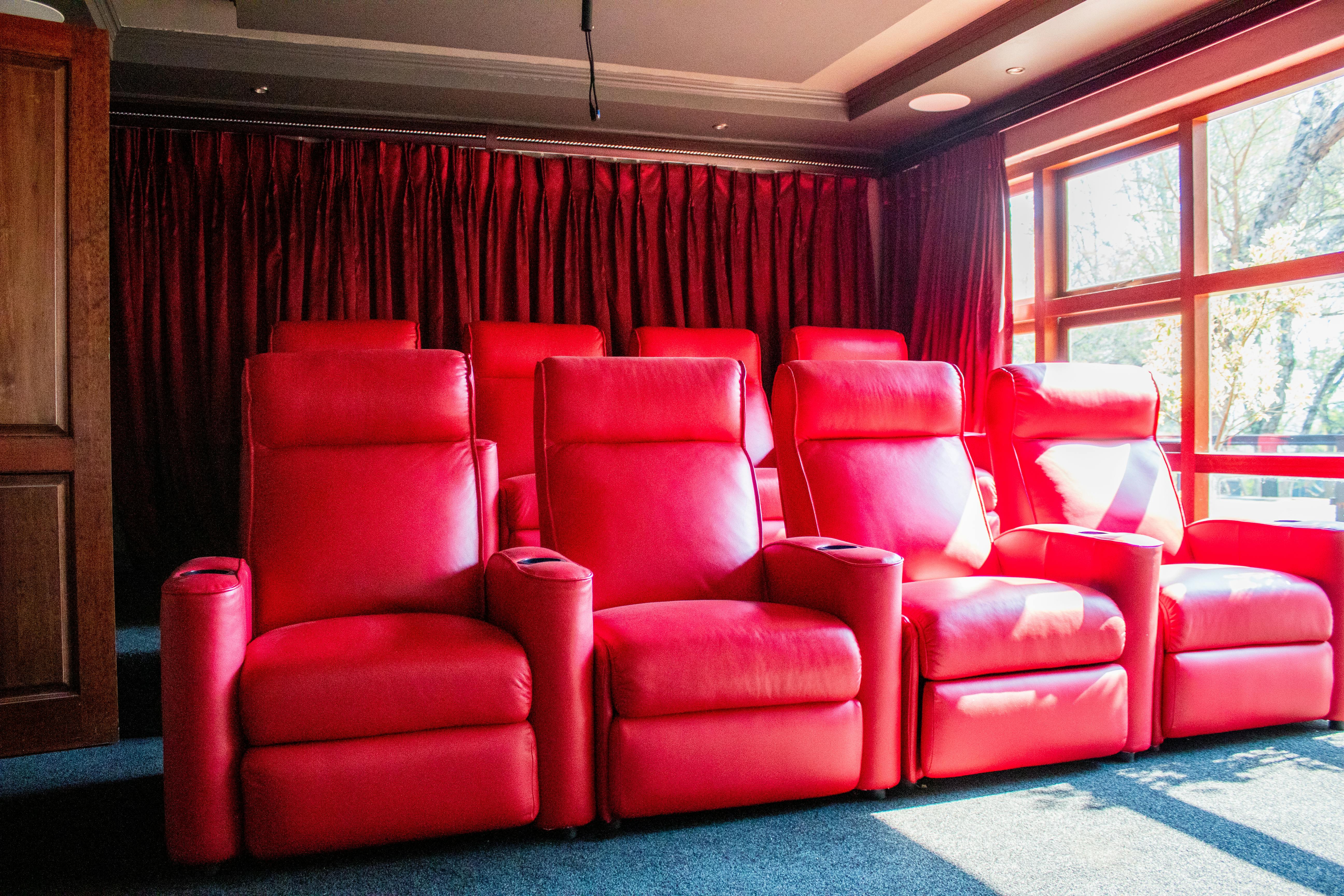 Red Leather Reclining Chair Inside the Theater Room at Home · Free ...