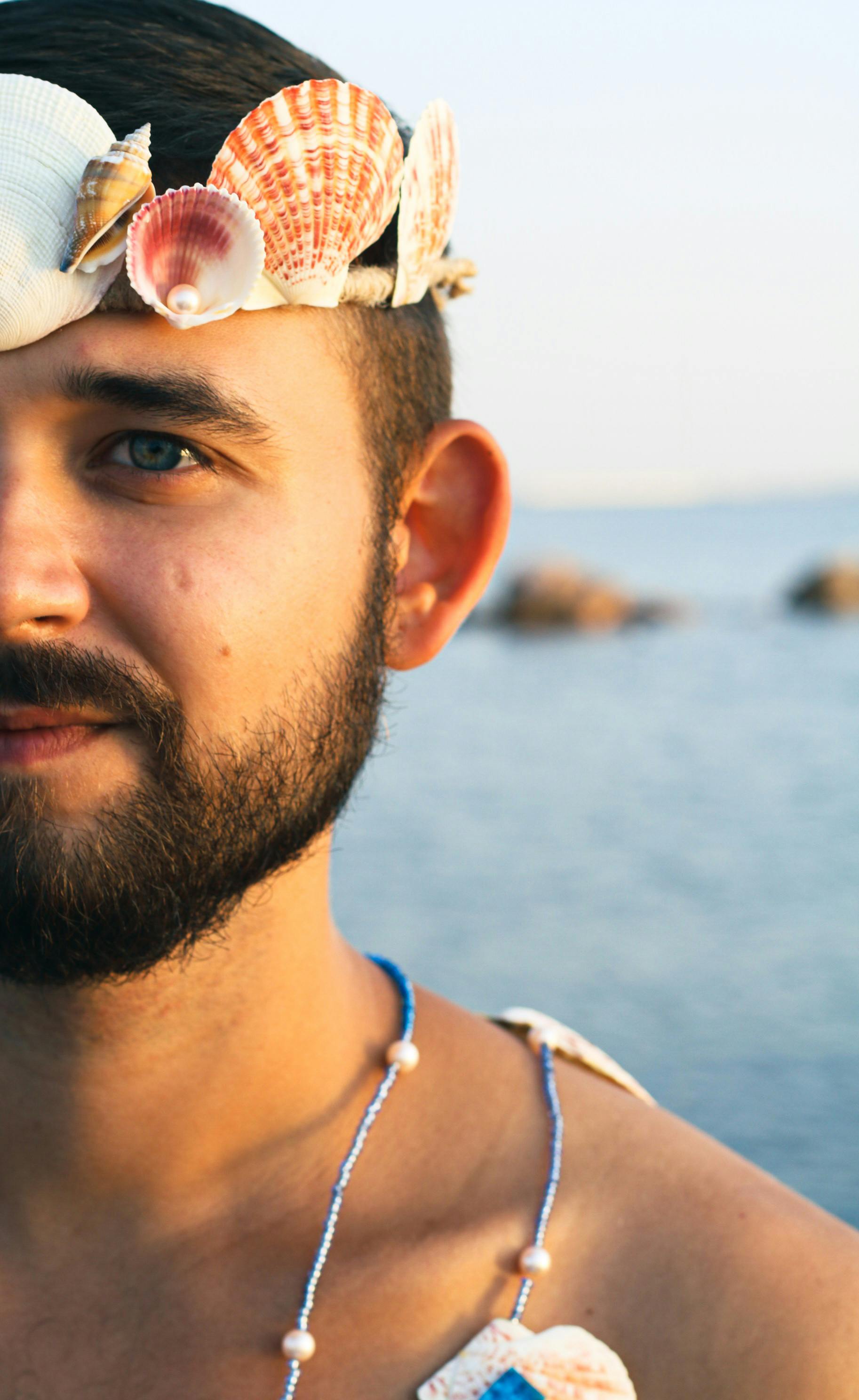 Man with Seashell Accessories · Free Stock Photo