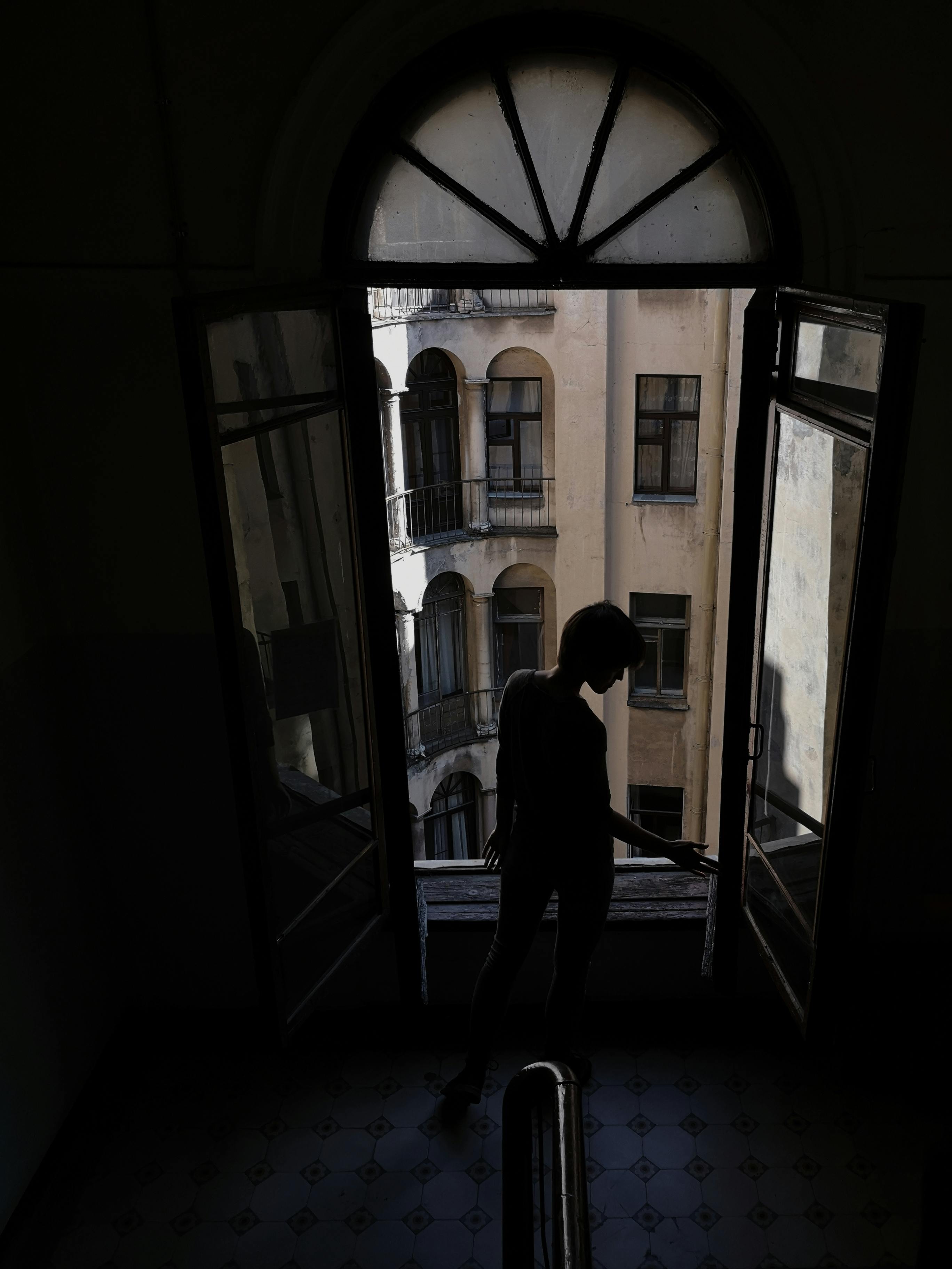 Man Standing Near the Window · Free Stock Photo