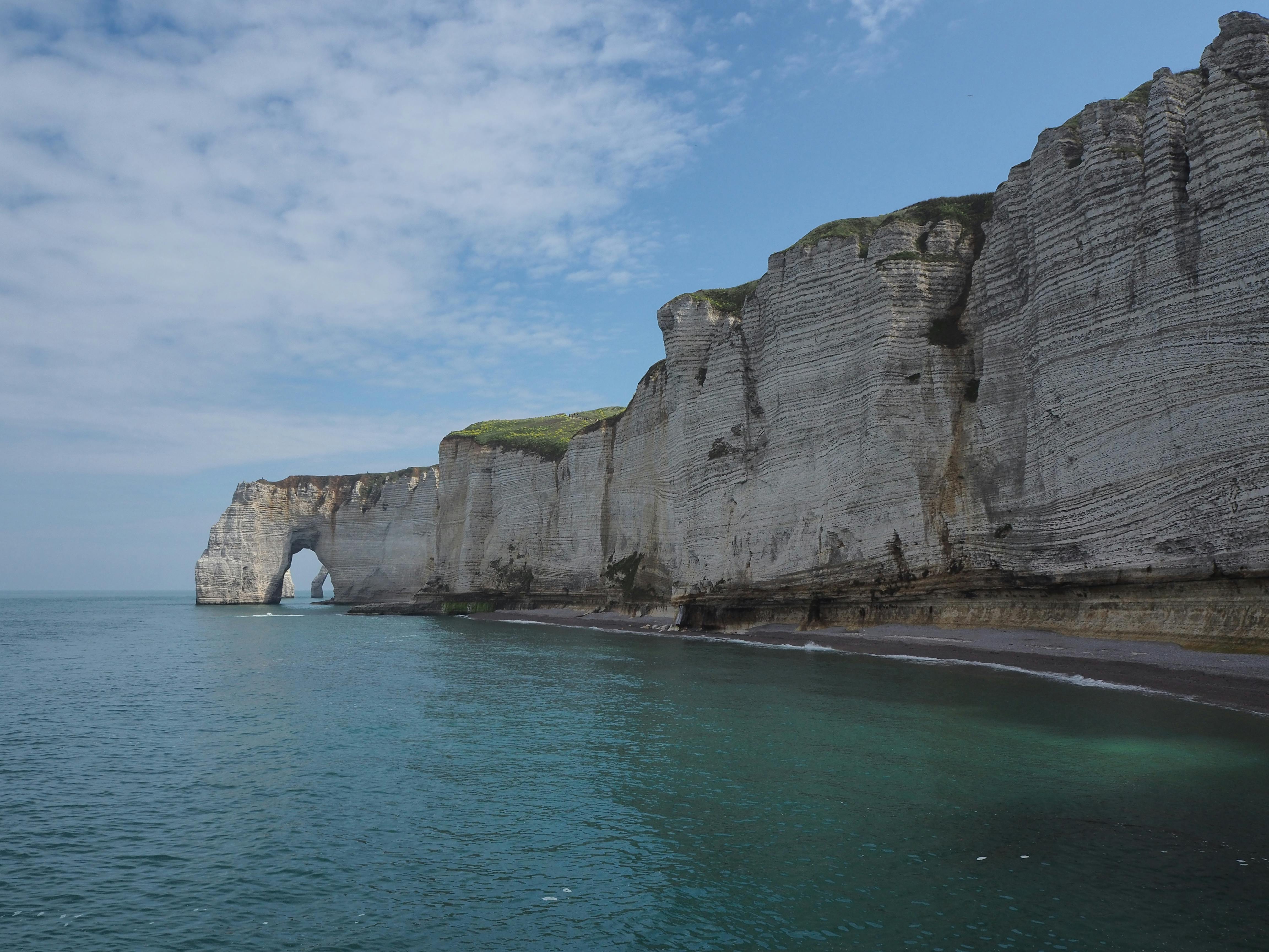 Rock Cliff Near Seashore · Free Stock Photo