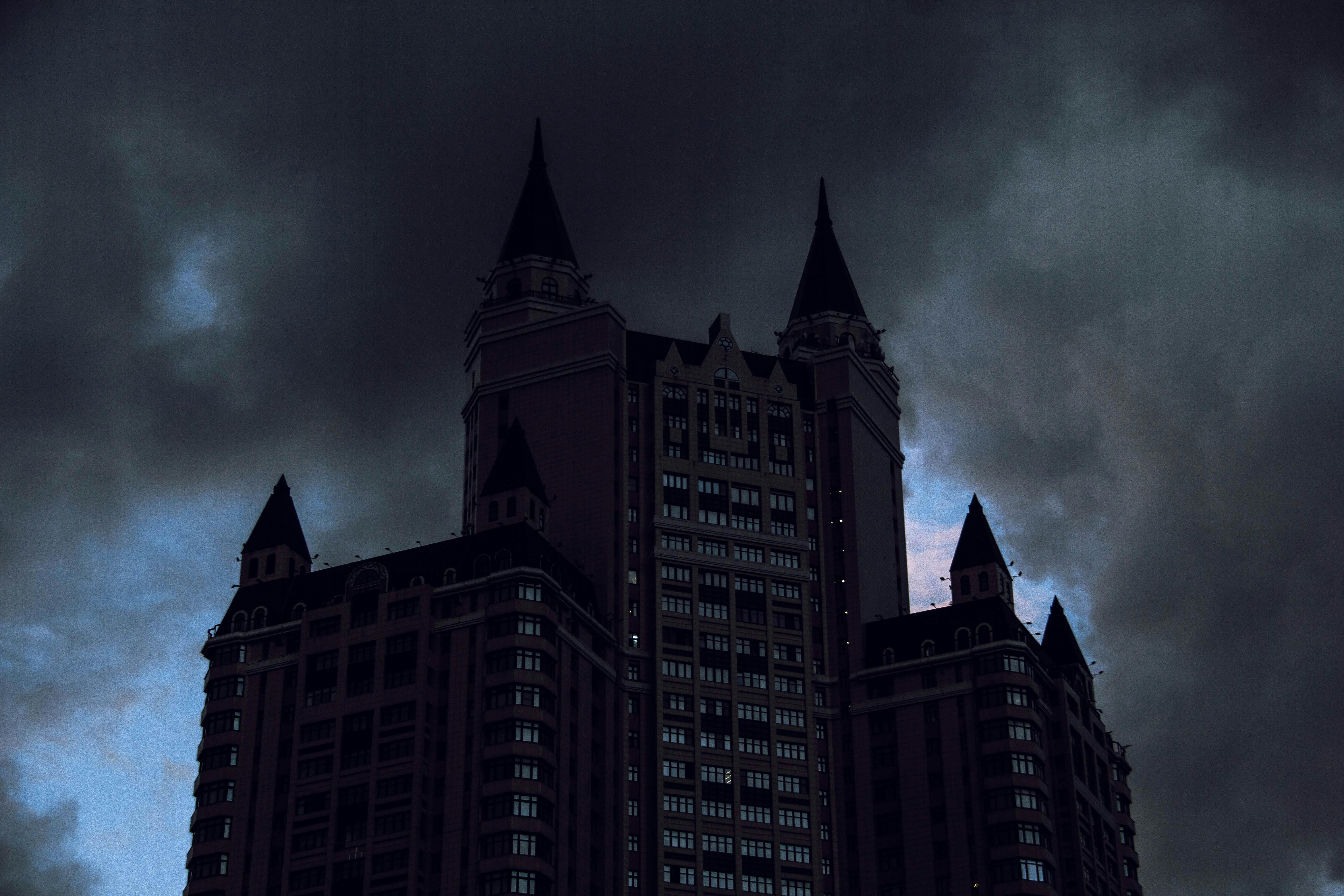 Concrete Building Under the Cloudy Sky · Free Stock Photo