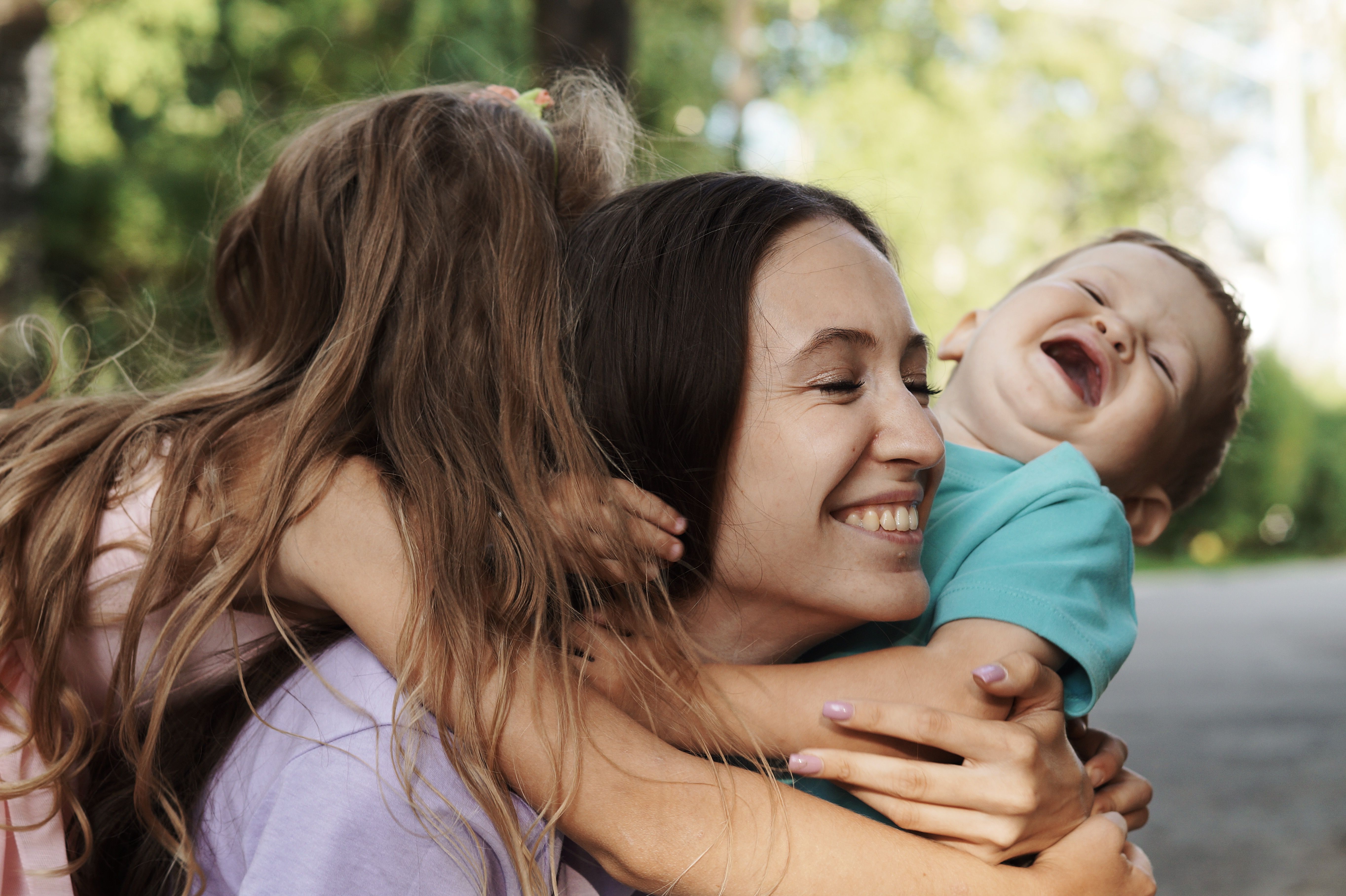 A Man Hugging a Child · Free Stock Photo