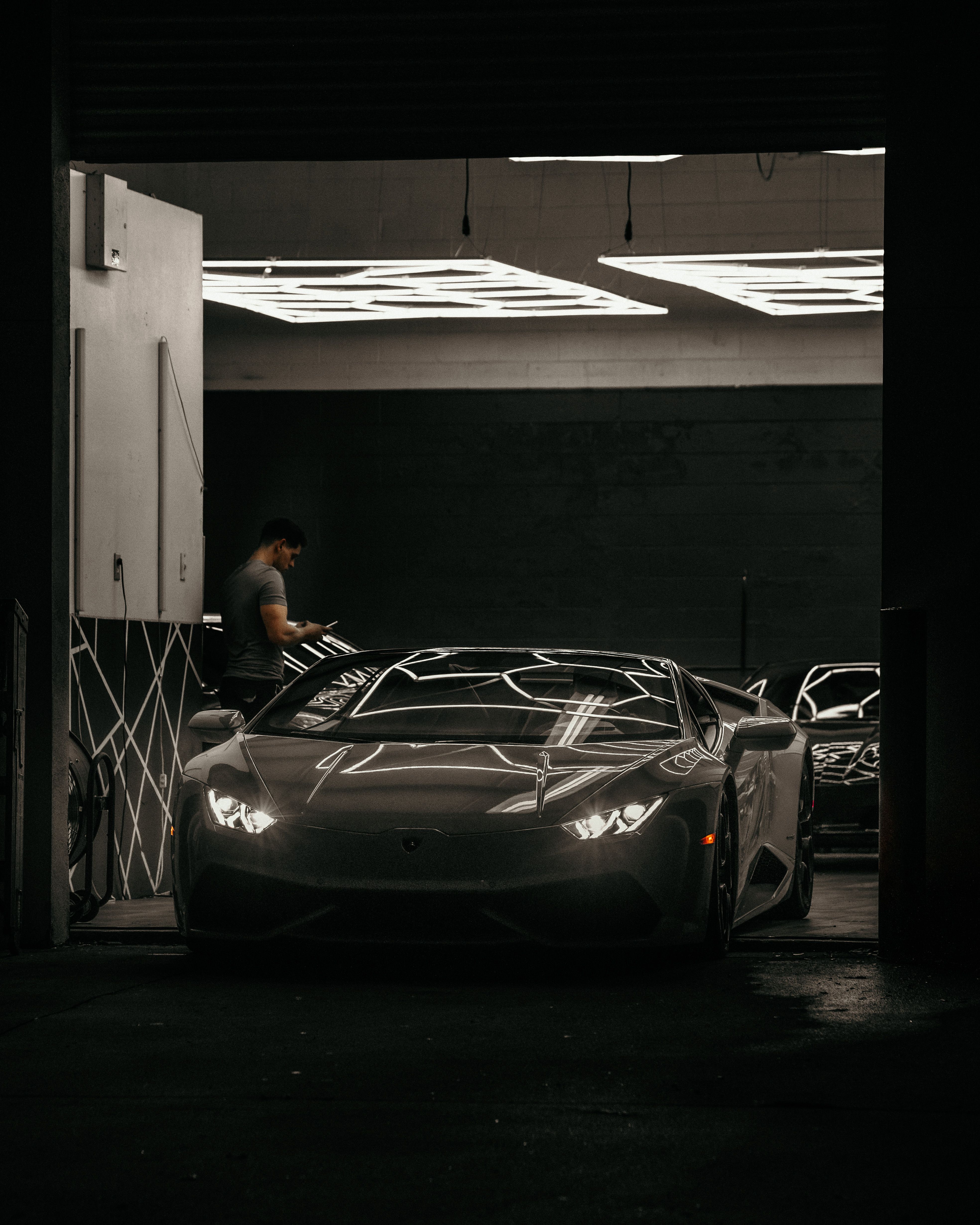 Lamborghini Aventador exiting a Garage · Free Stock Photo