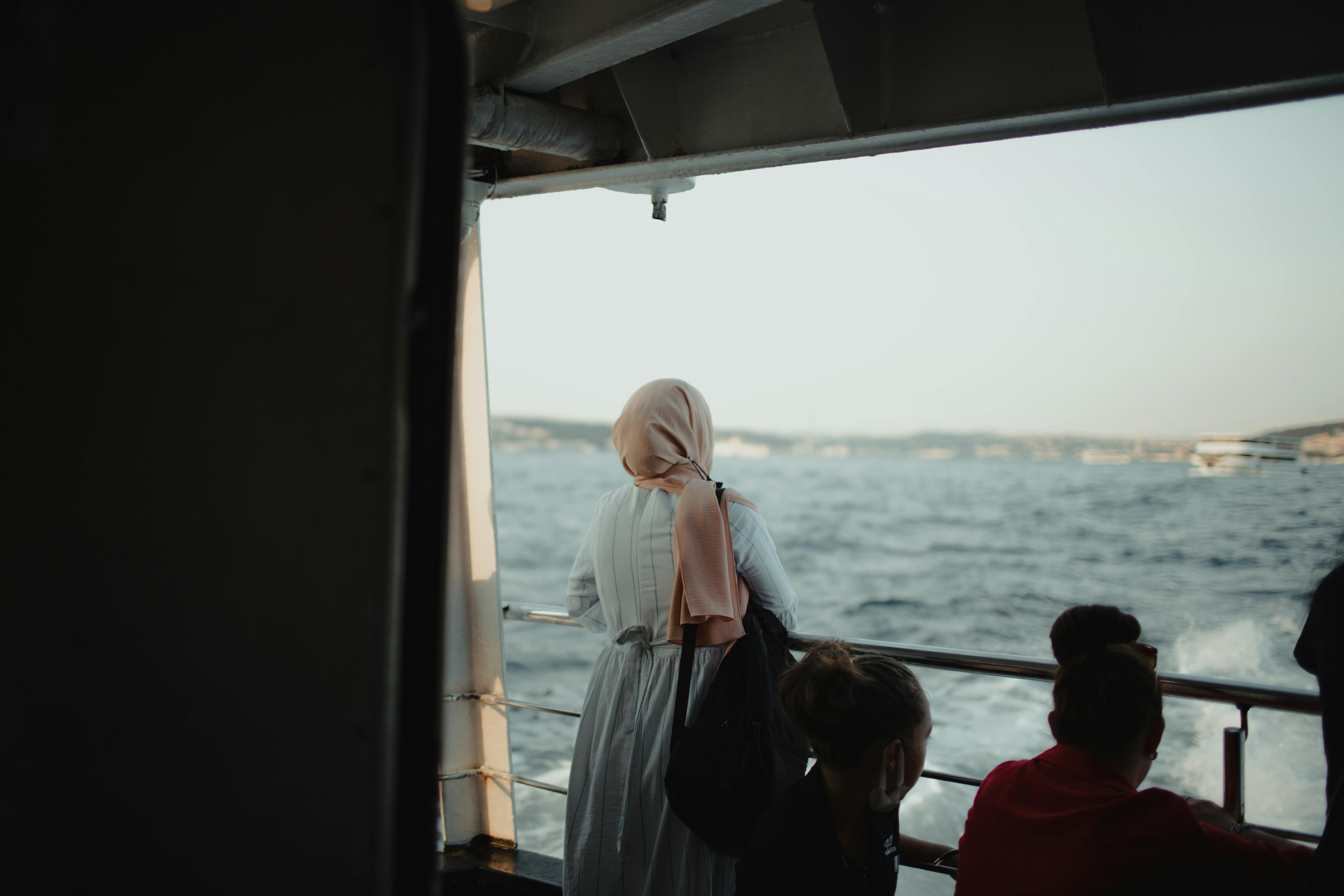 Person Leaning on Road Railings at The Side of a Road · Free Stock Photo
