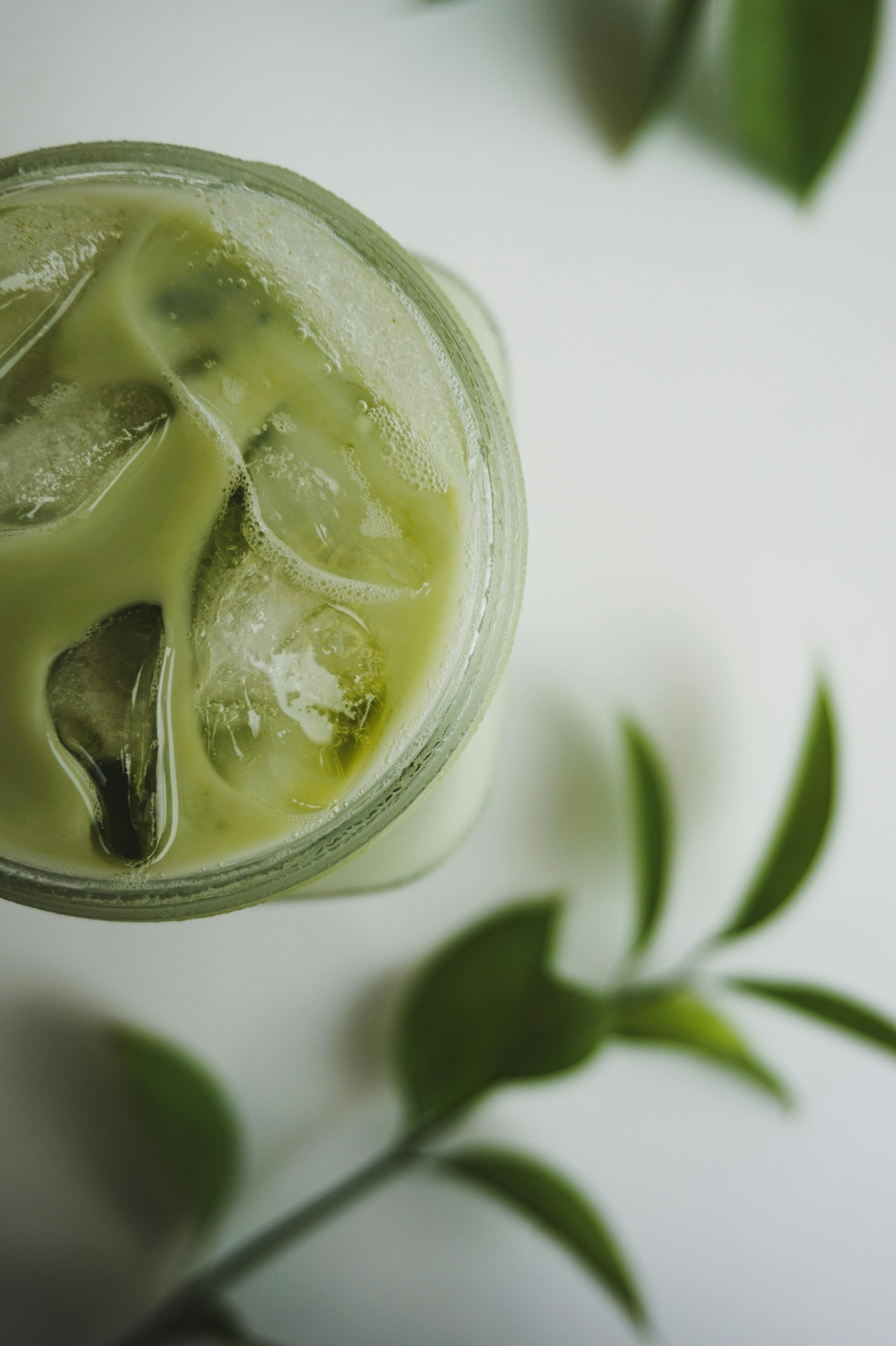 A Green Drink with Ice in a Clear Glass · Free Stock Photo