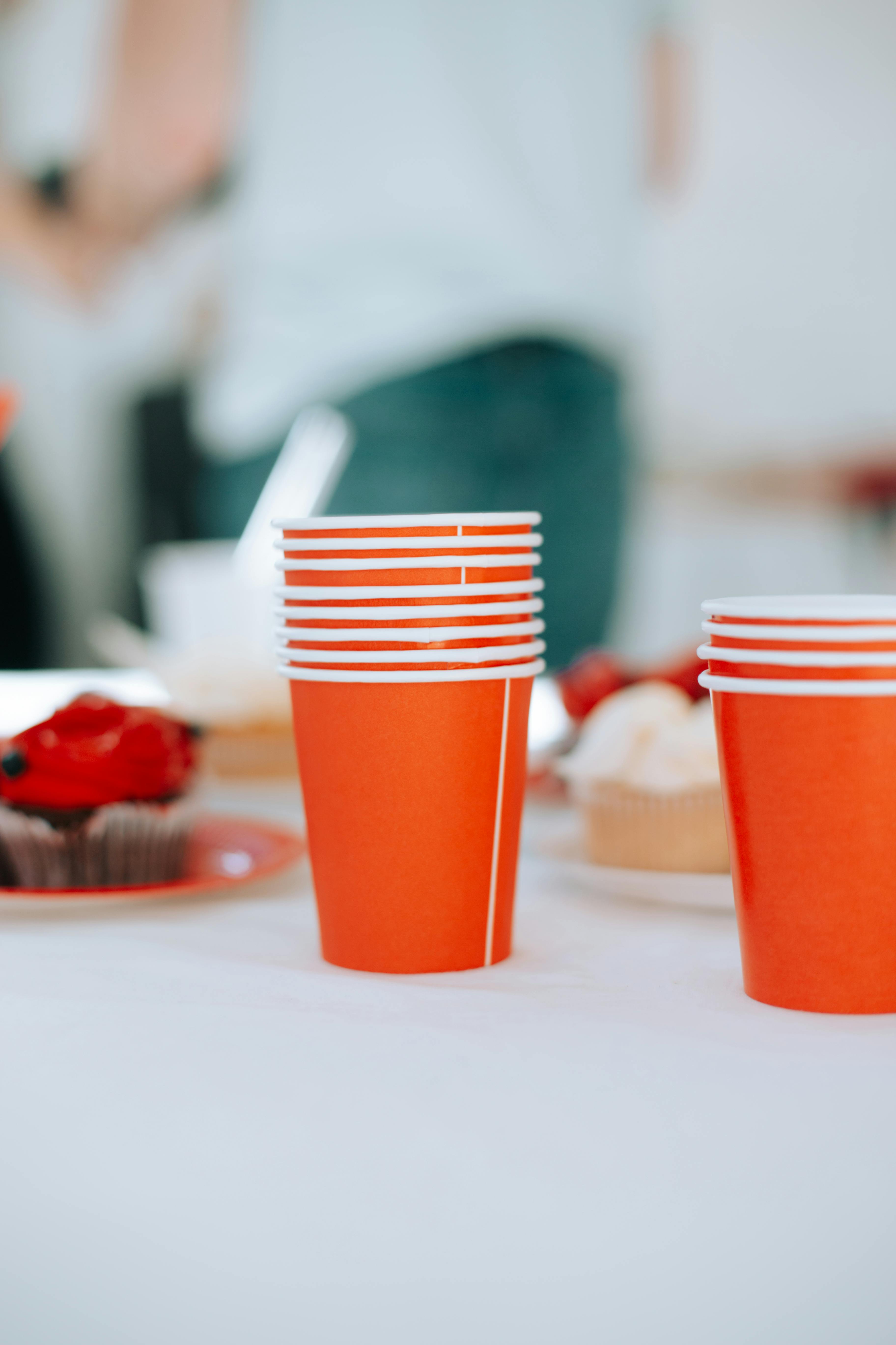 Orange Paper Cups on the Table · Free Stock Photo