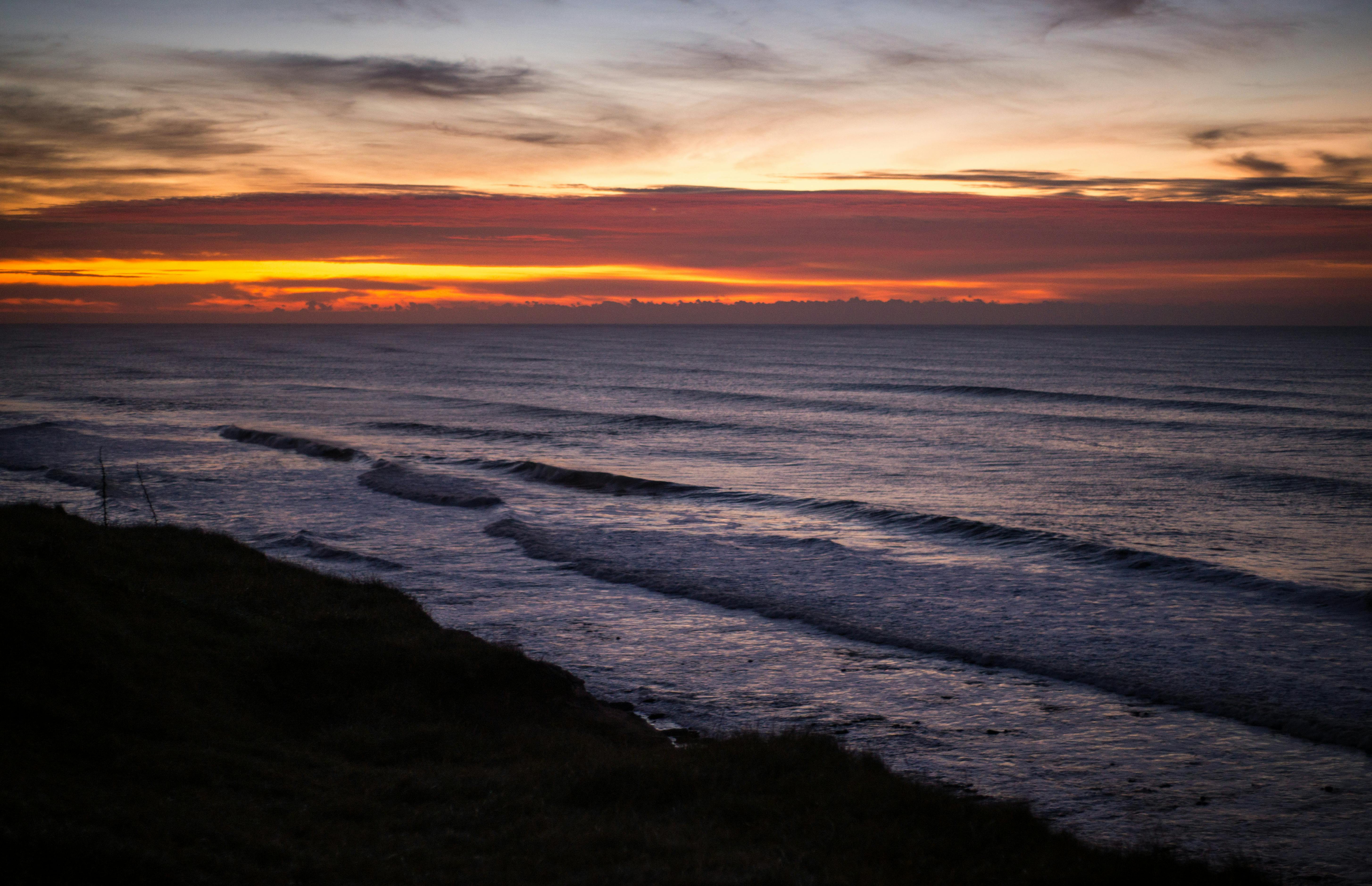 Ocean Waves Crashing during Sunset · Free Stock Photo