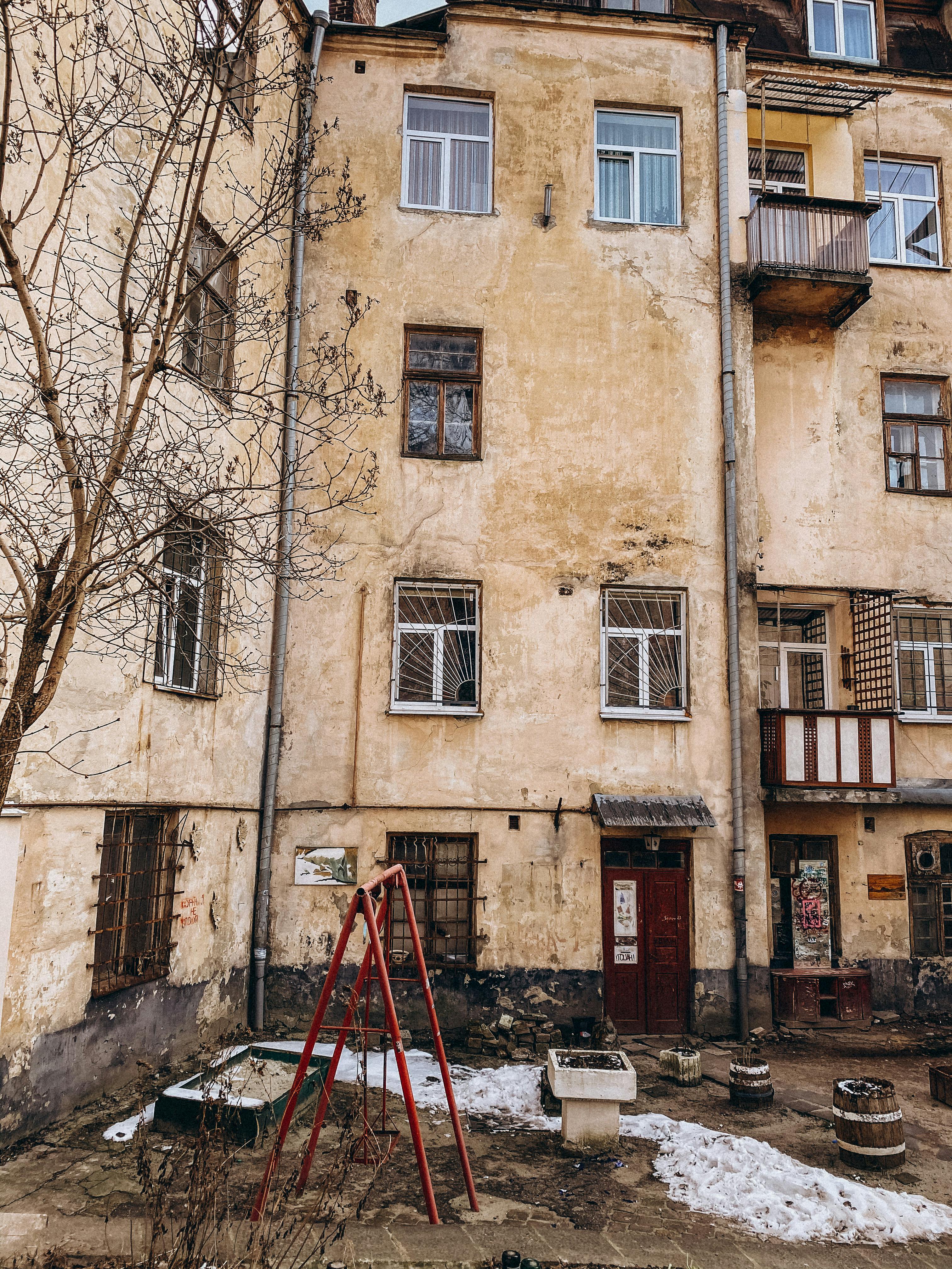 Exterior of an Old Run-down Residential Building · Free Stock Photo