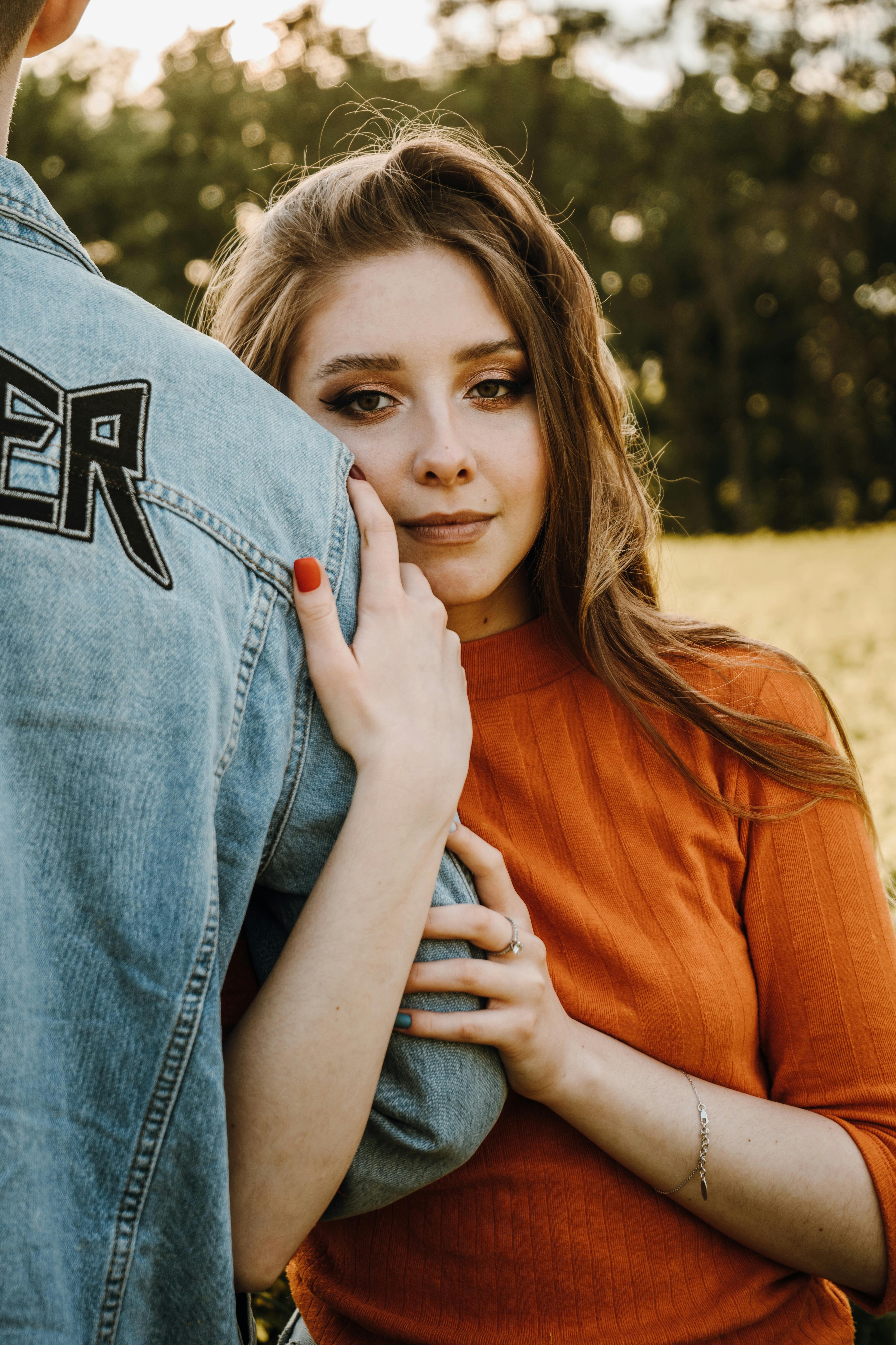 A Woman Embracing a Man's Arm · Free Stock Photo