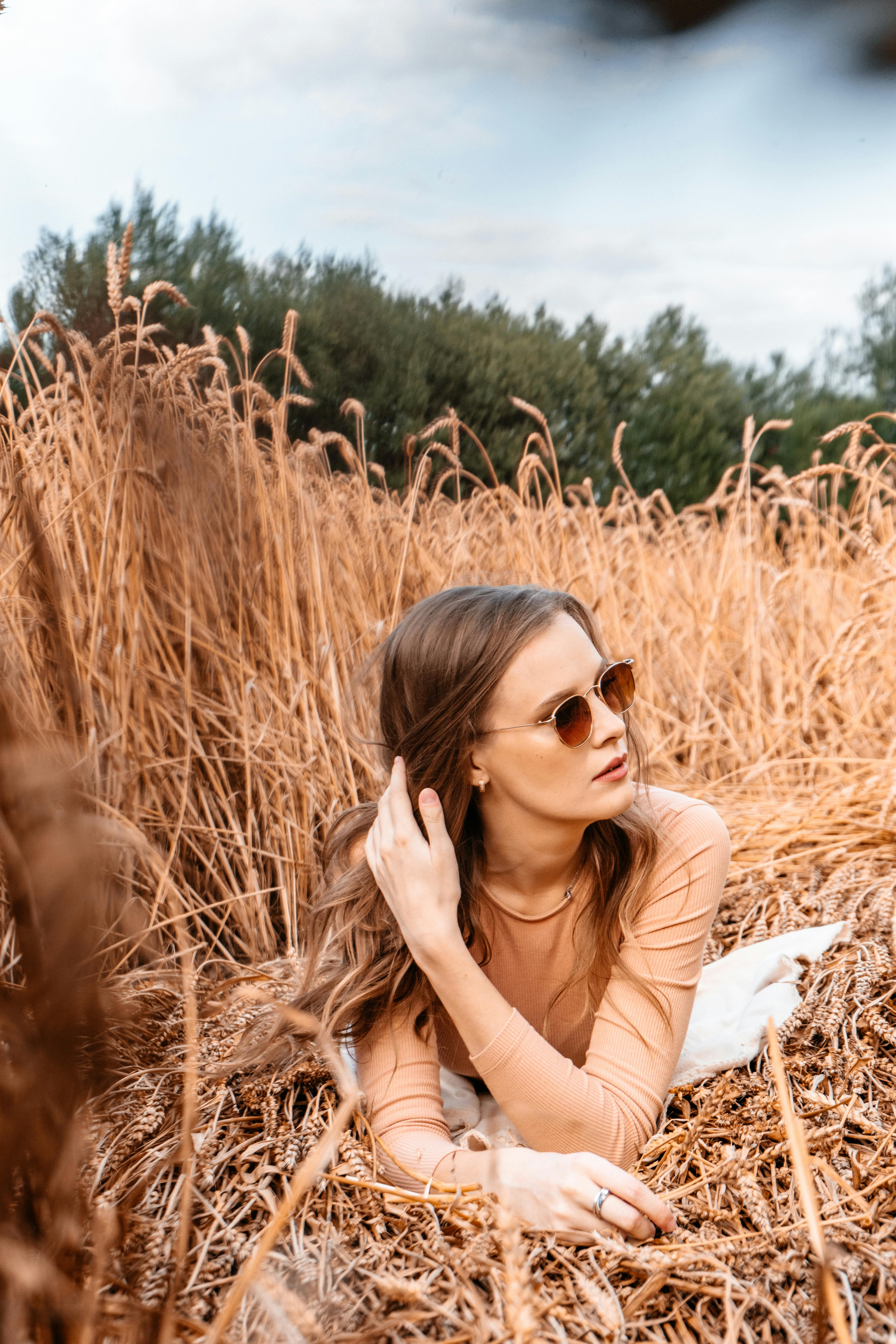 Woman Walking Through Field of Wheat · Free Stock Photo