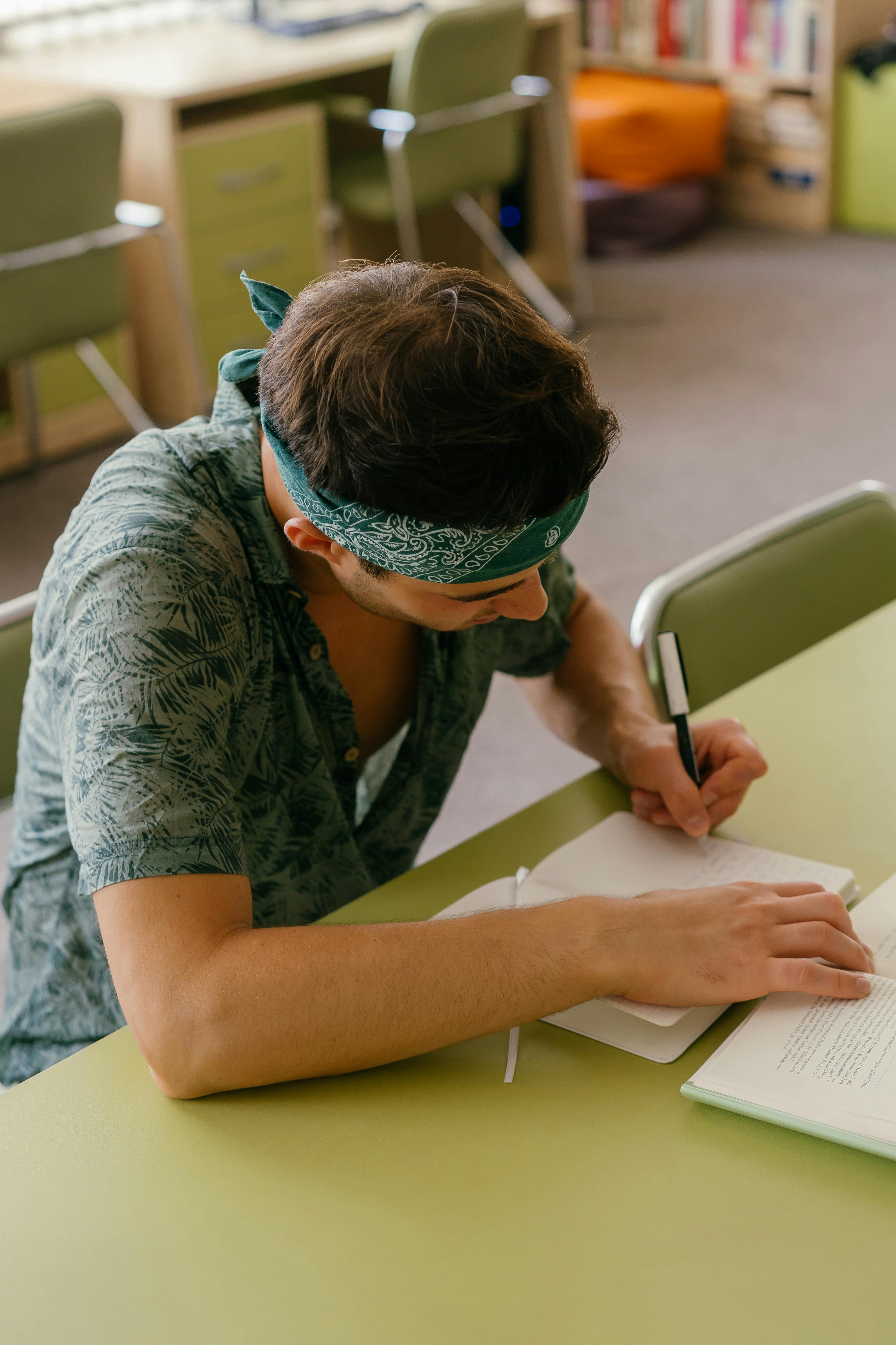 A Man Studying Inside the Library · Free Stock Photo