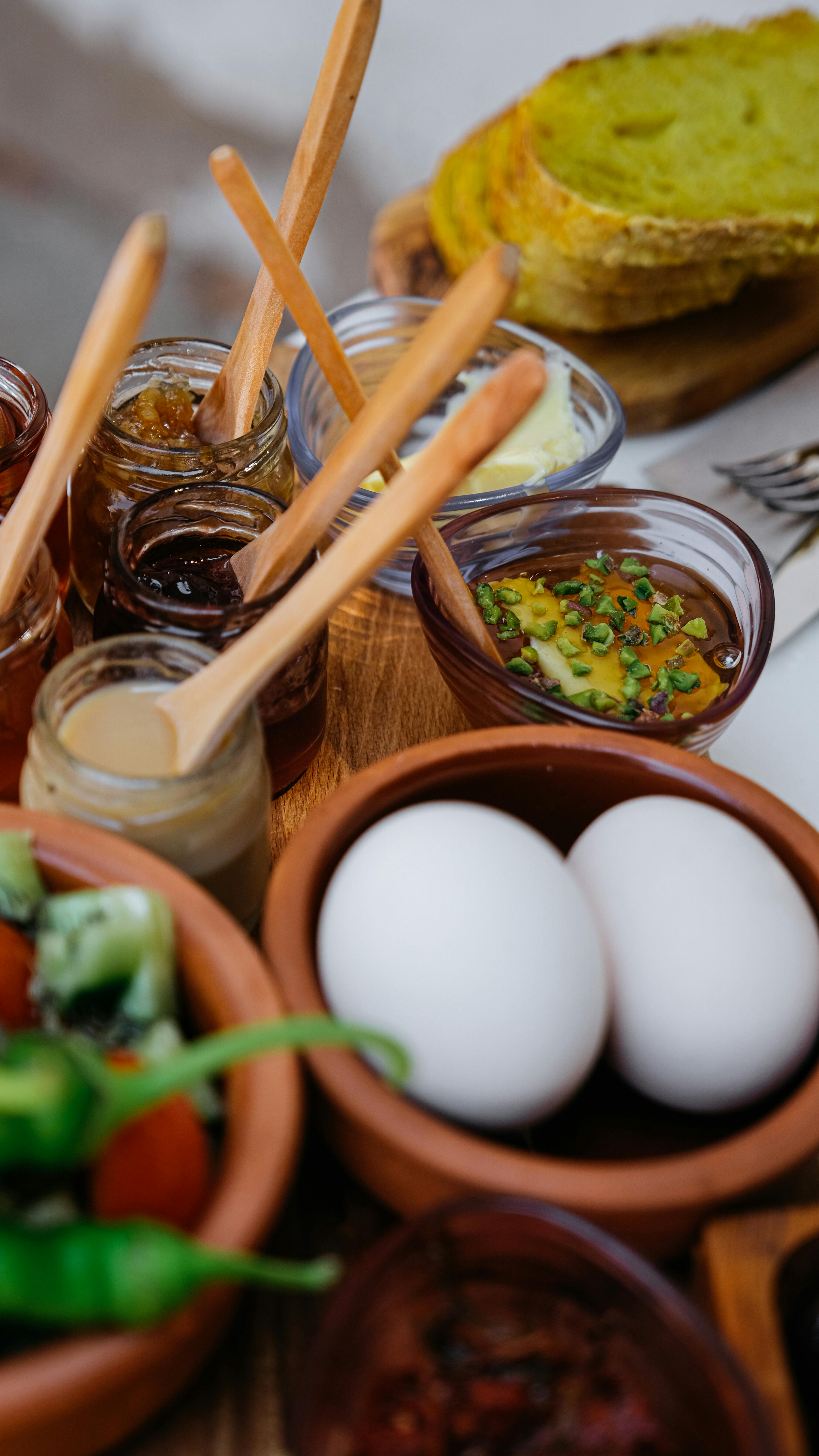 Eggs in a Bowl with Bread and Condiments · Free Stock Photo