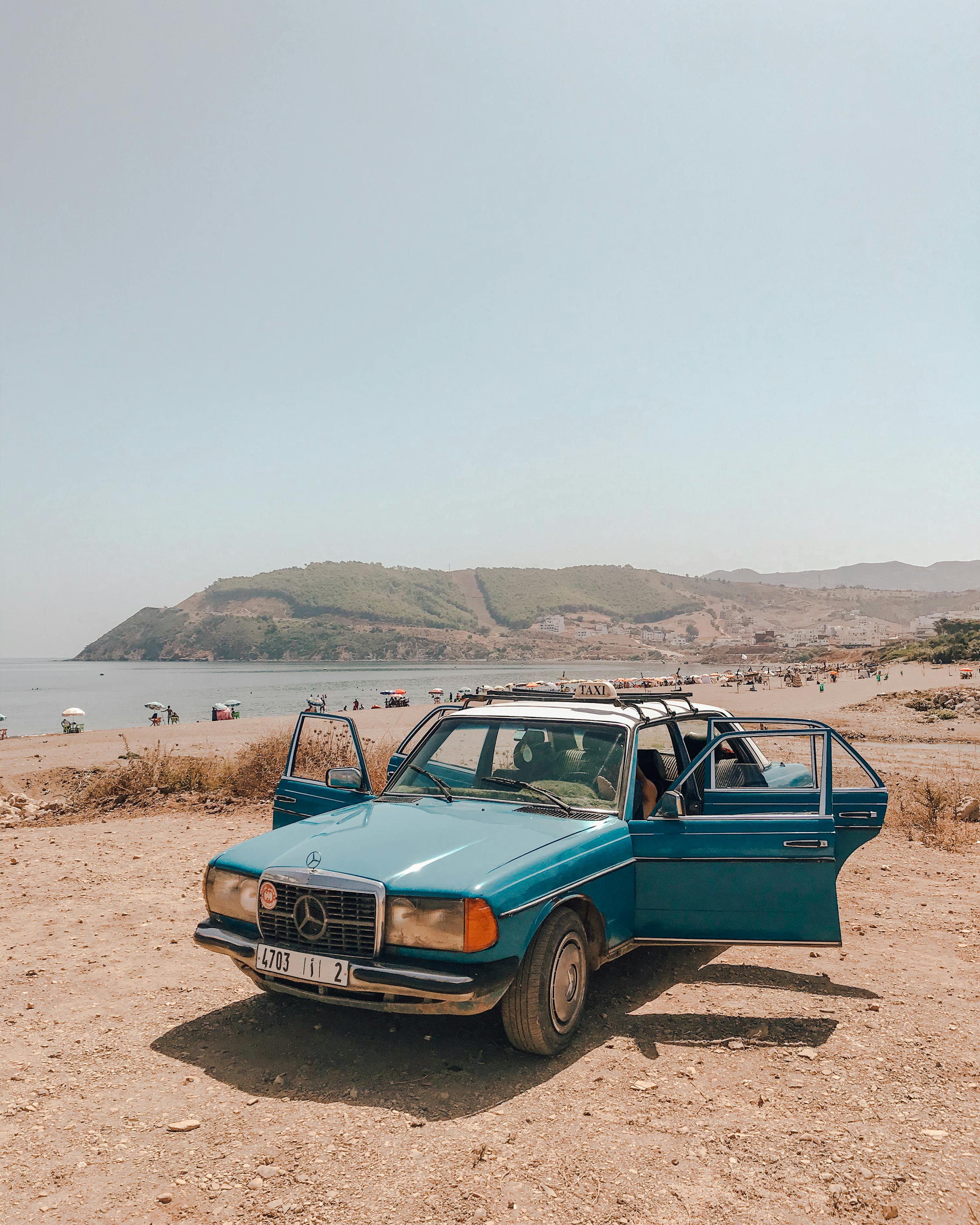 Blue Car on Brown Sand · Free Stock Photo