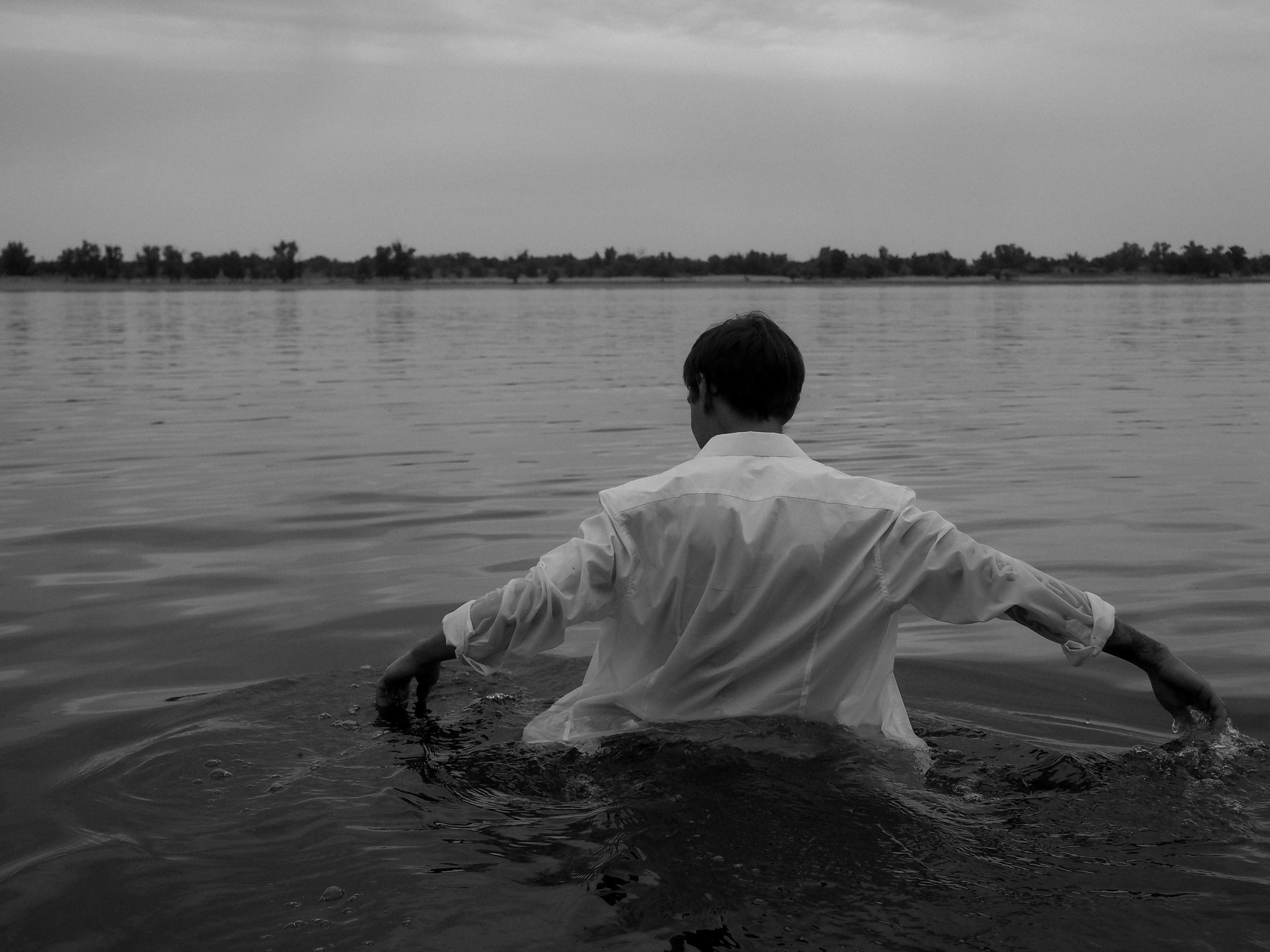 Man Walking on Shallow Water · Free Stock Photo