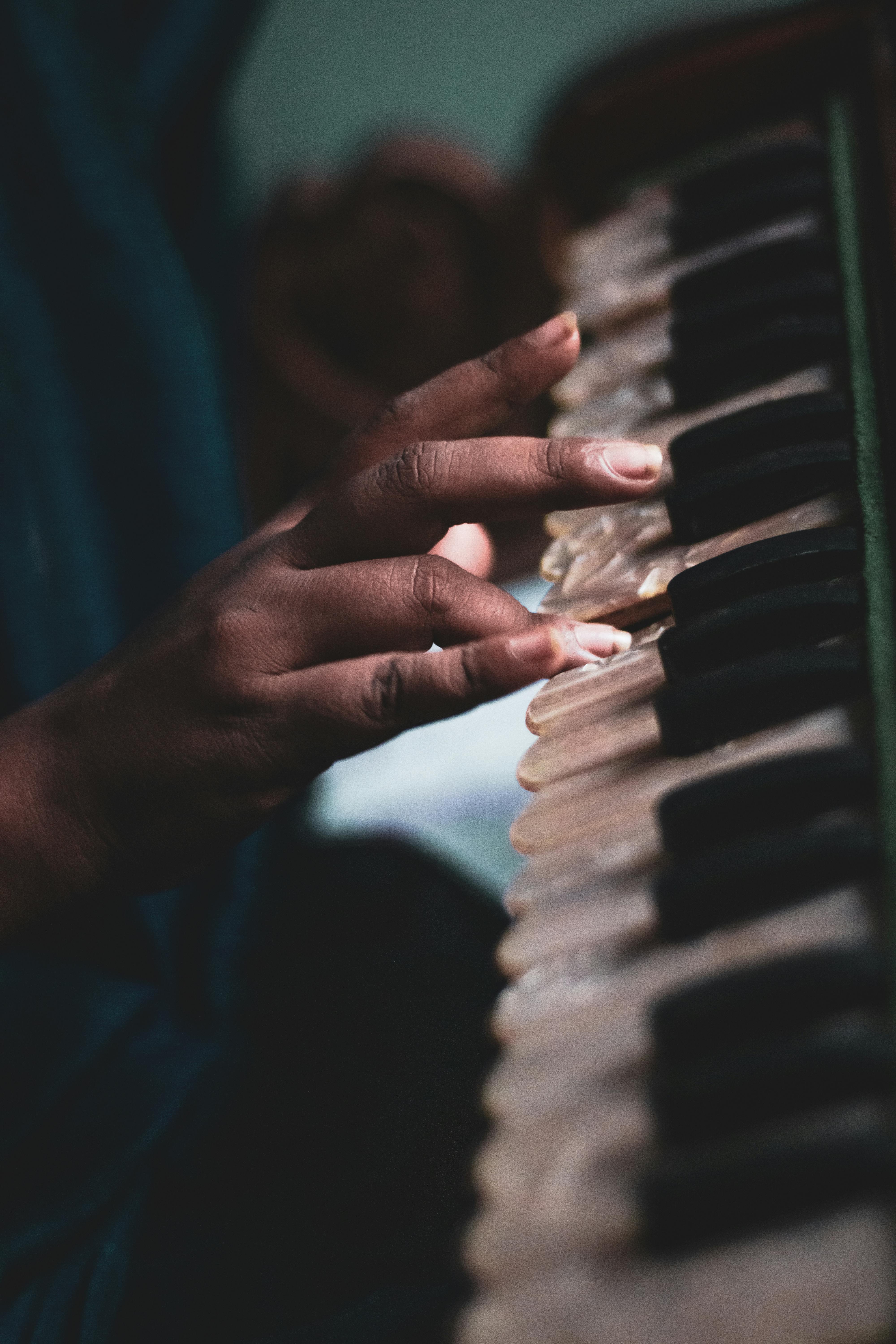 Man Playing Triangle Instrument · Free Stock Photo