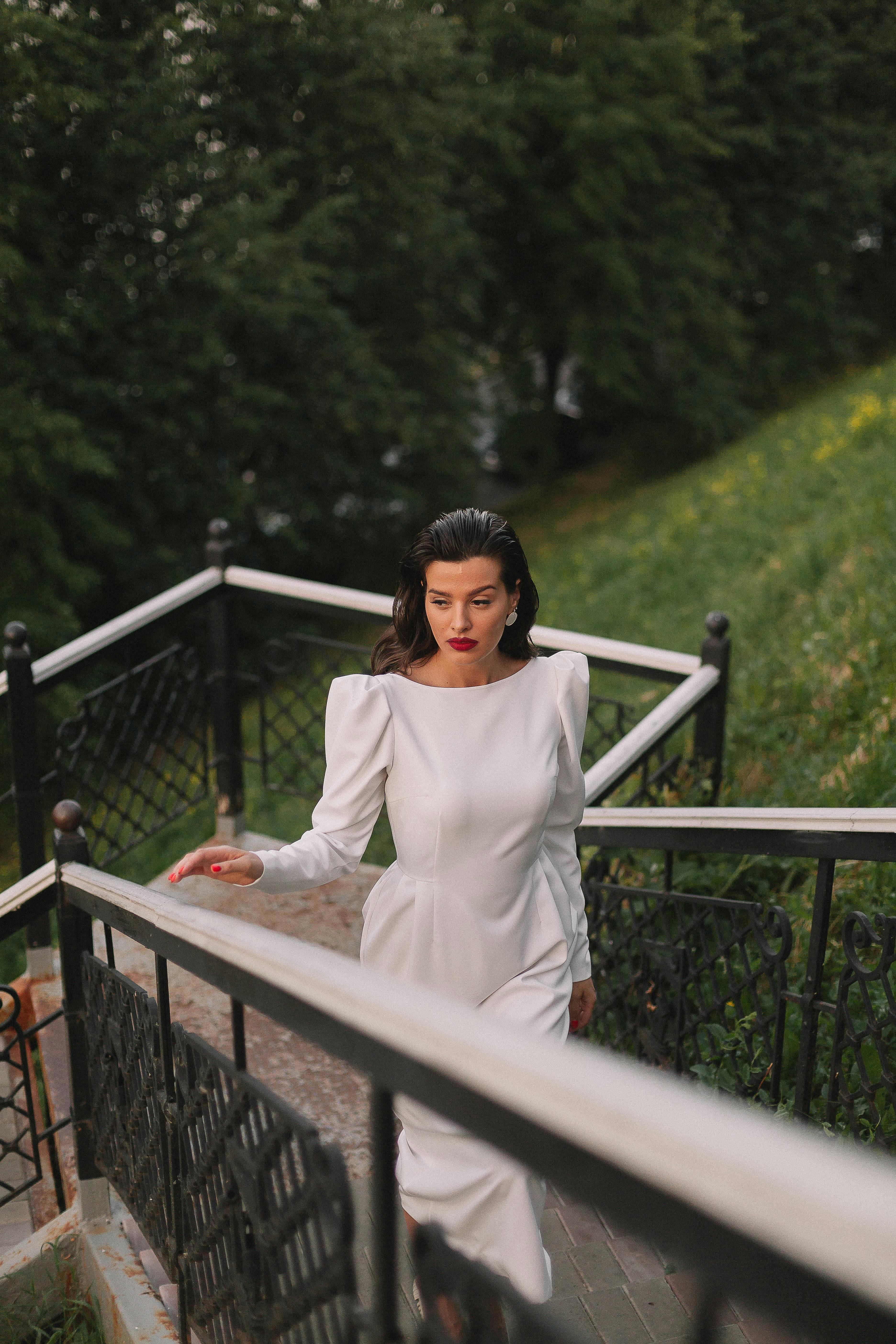 Woman in Dress on Stairs · Free Stock Photo