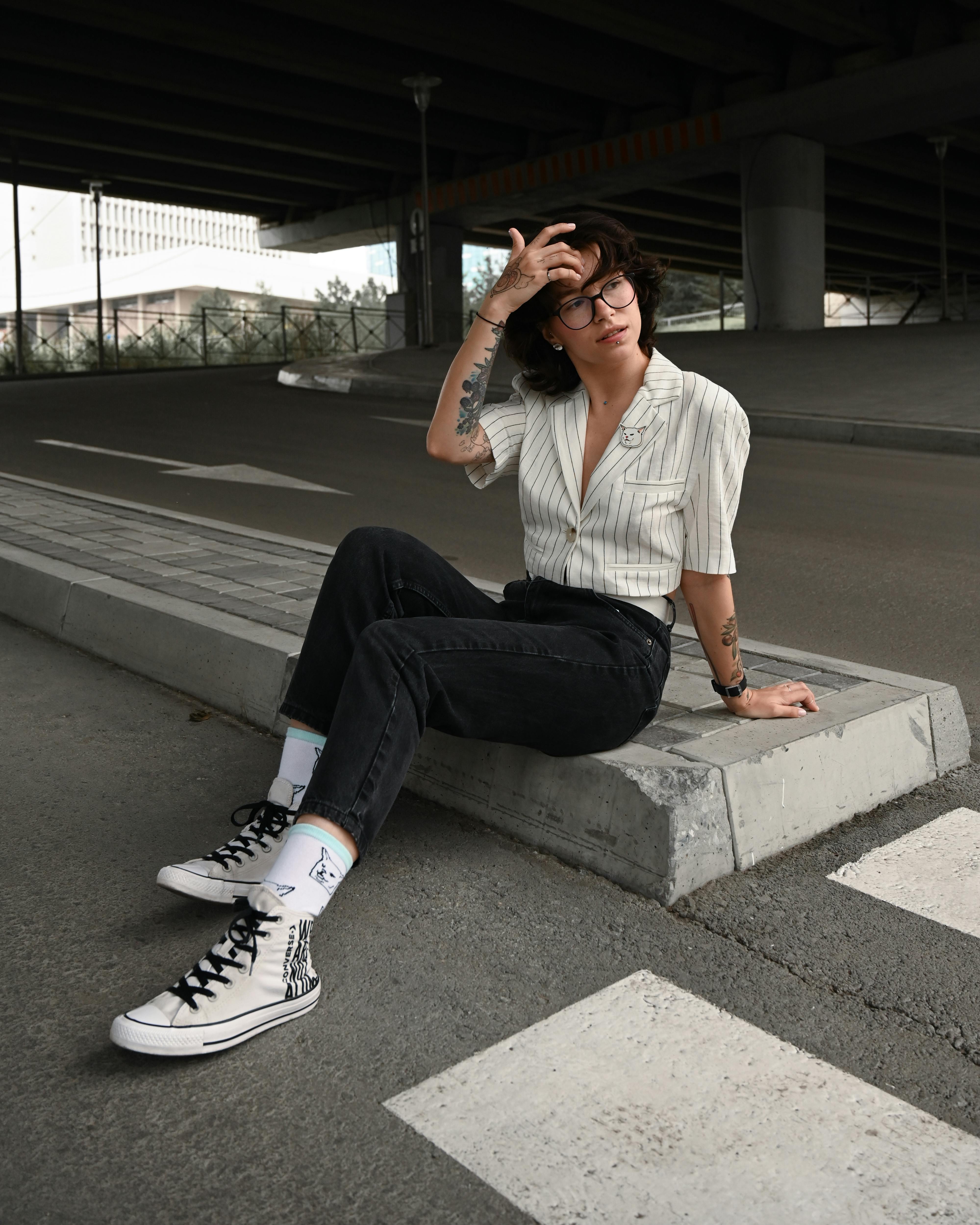 Photo of Posing Woman Sitting on Window Sill · Free Stock Photo