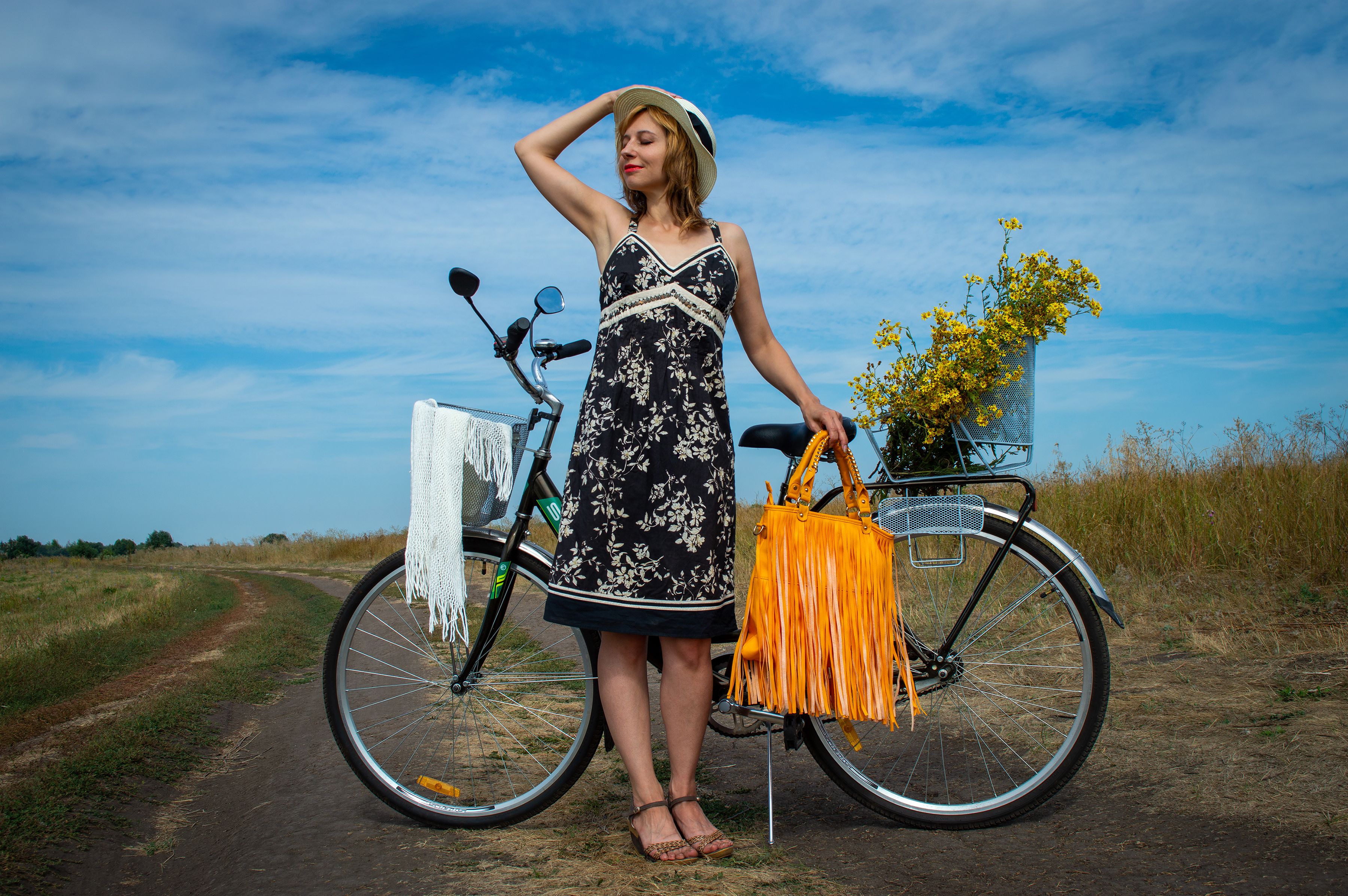 Photo of a Woman in a Black Dress Standing Beside Her Bicycle · Free ...