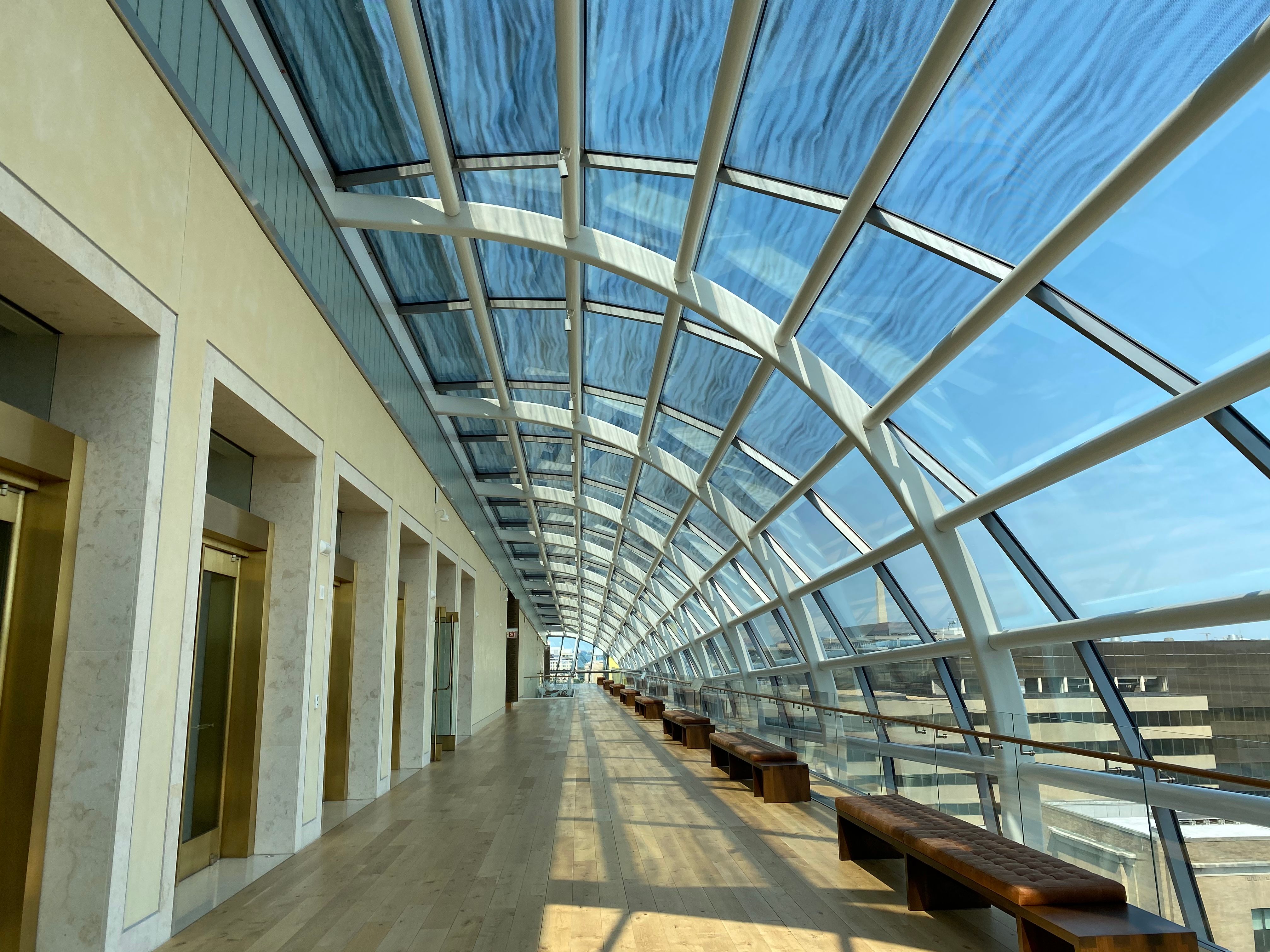 Glass Corridor with Benches · Free Stock Photo