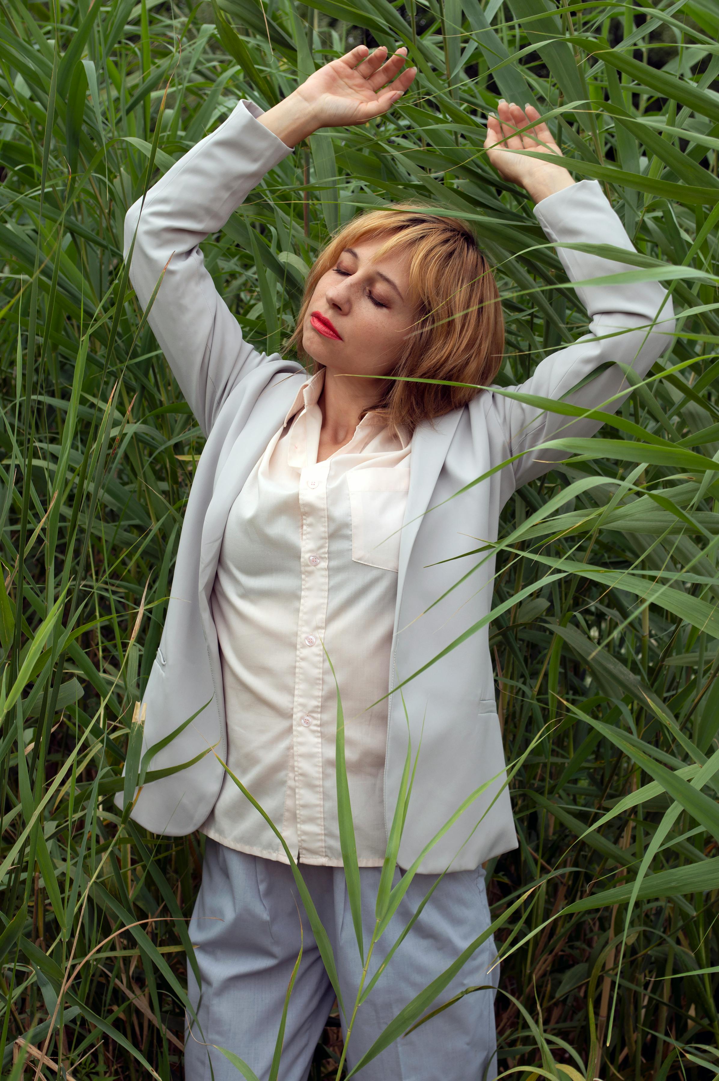 Photograph of Girls Holding Flowers High in Hands · Free Stock Photo
