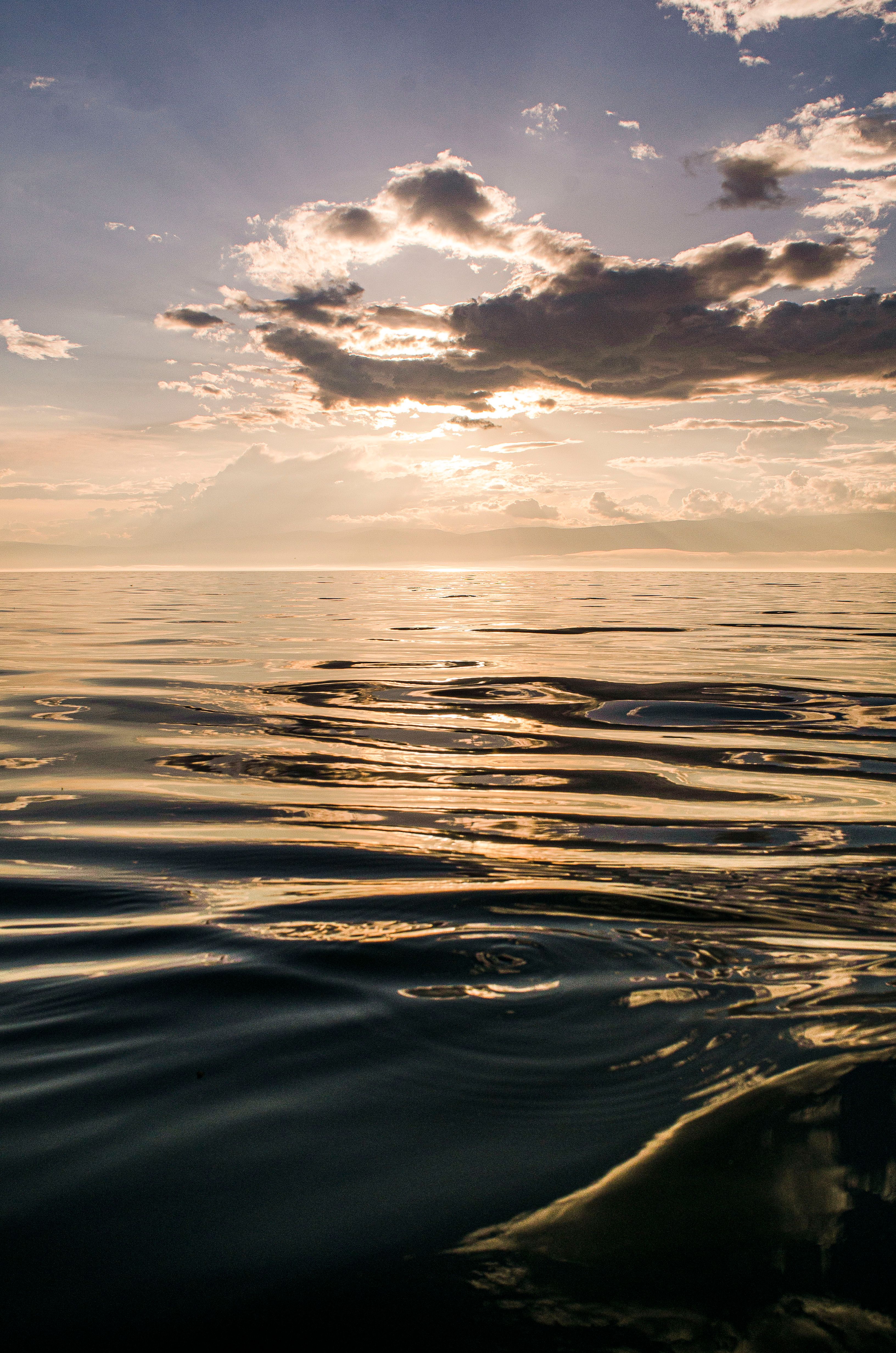 Close-Up Shot of Sea Water during Sunset · Free Stock Photo