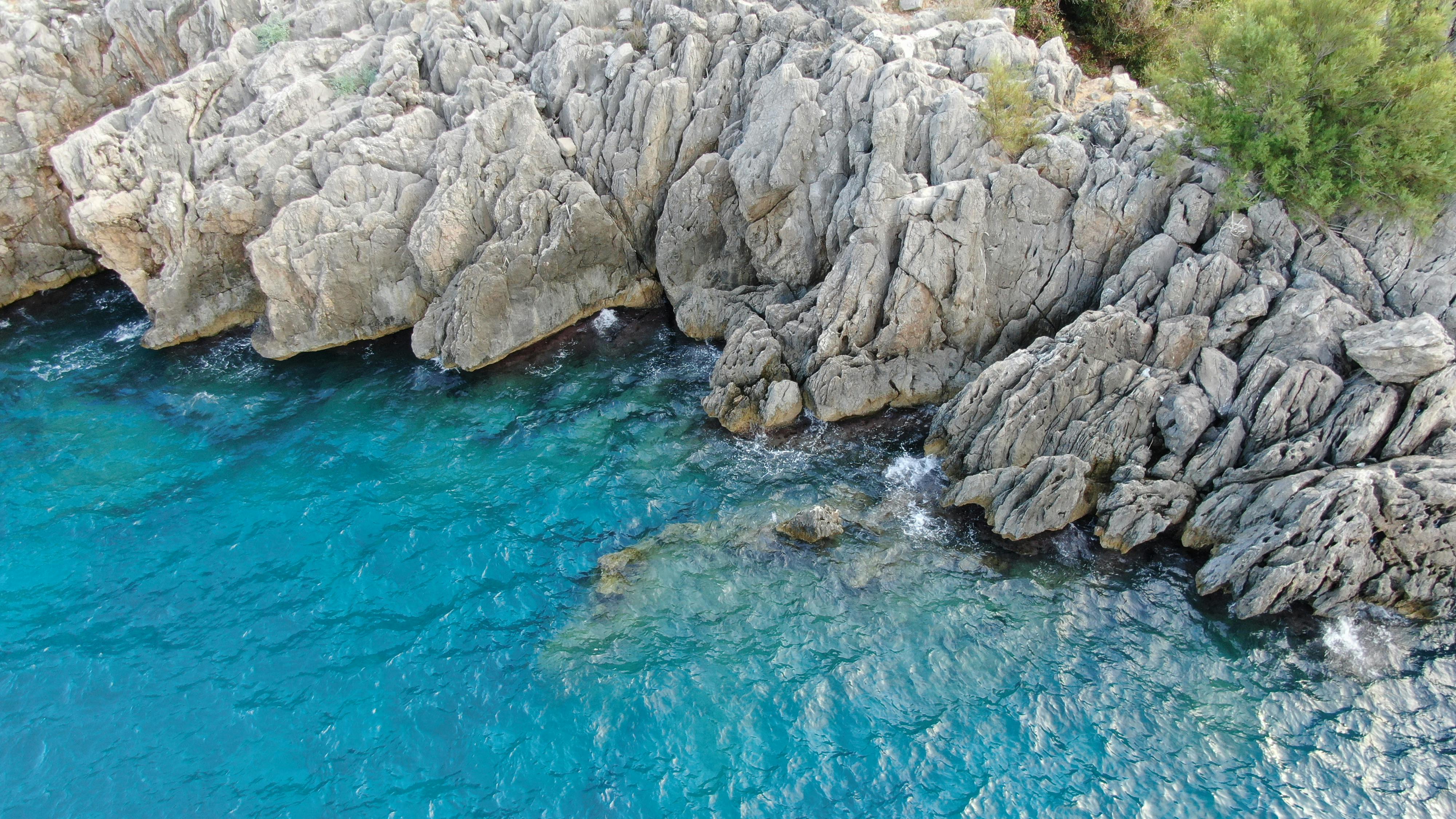 Rock Cliffs near Blue Ocean · Free Stock Photo