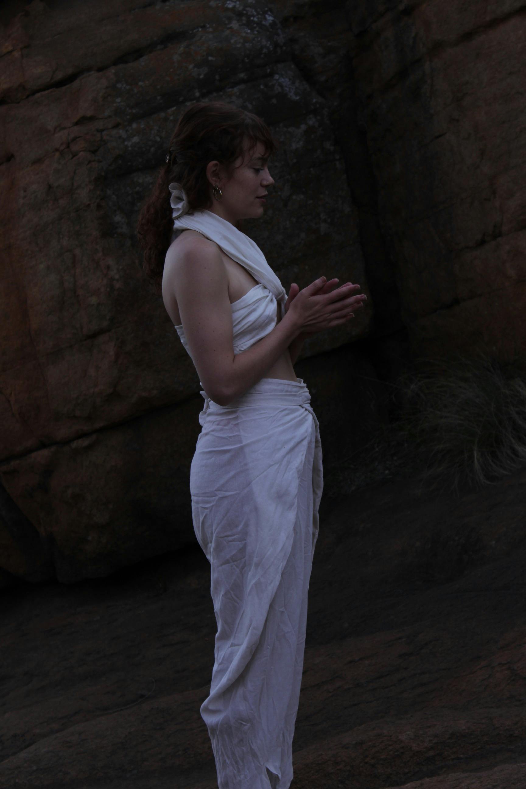 A Standing Woman in White Clothing · Free Stock Photo