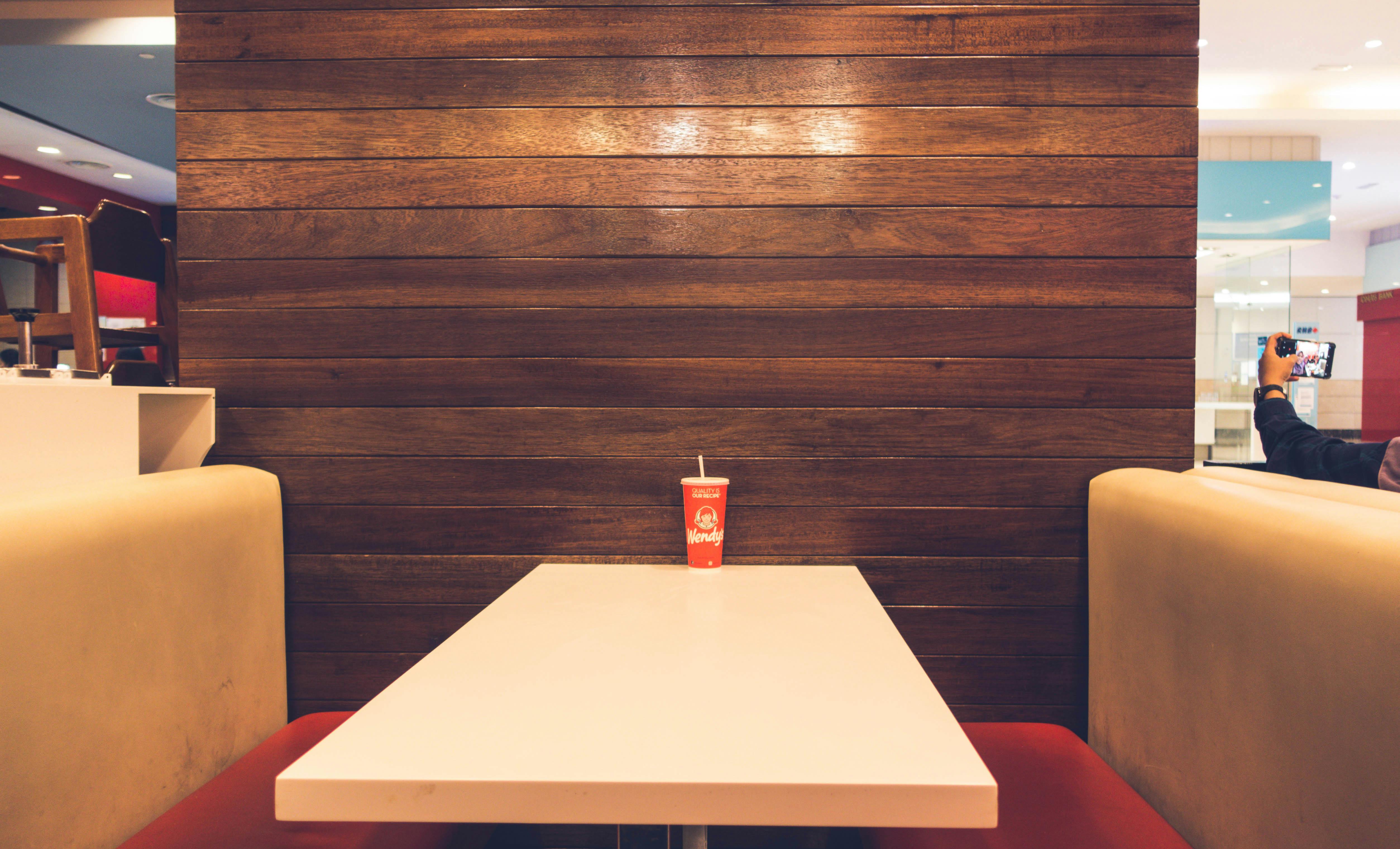 Red Disposable Cup on White Table · Free Stock Photo
